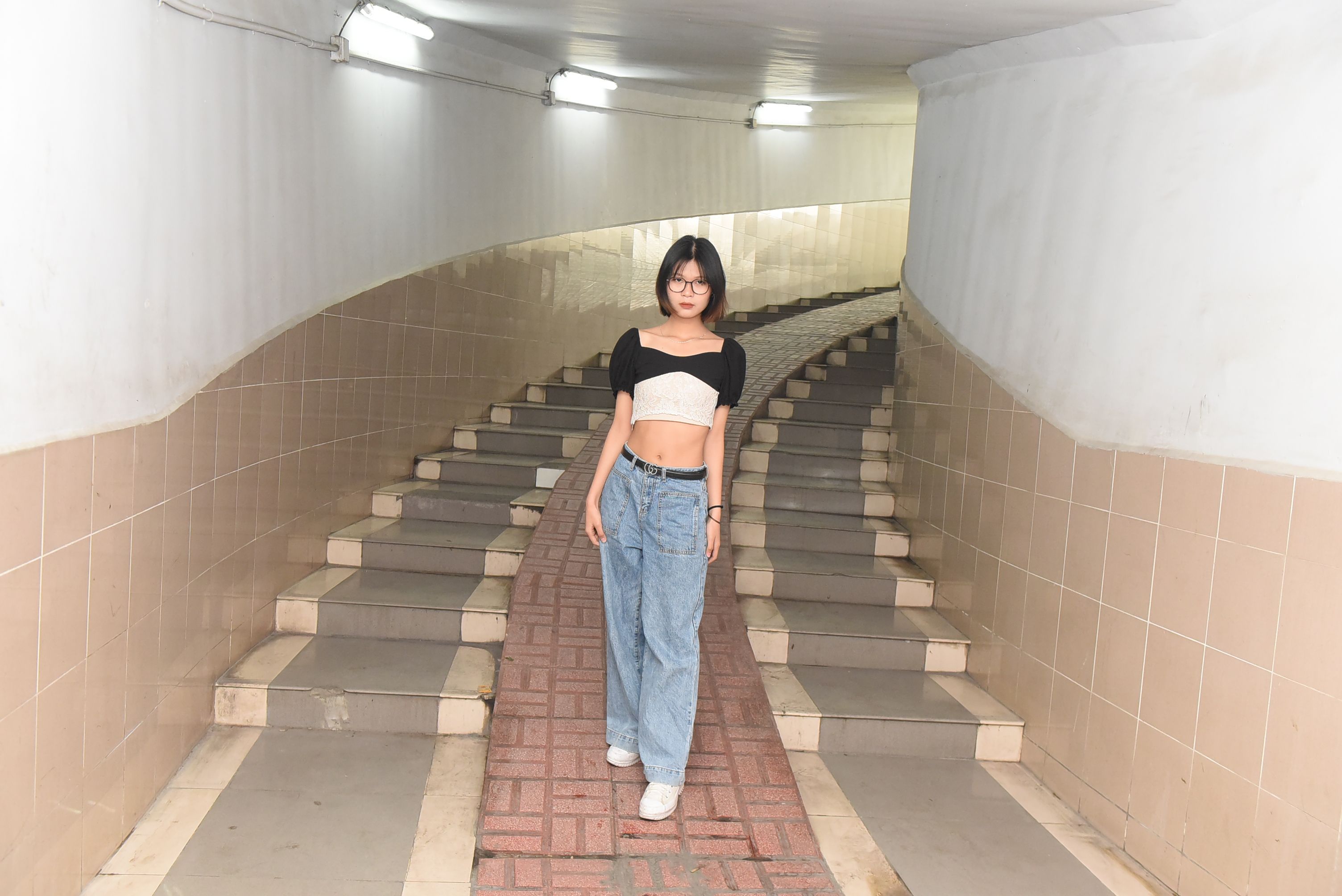 Woman Posing in Corridor · Free Stock Photo