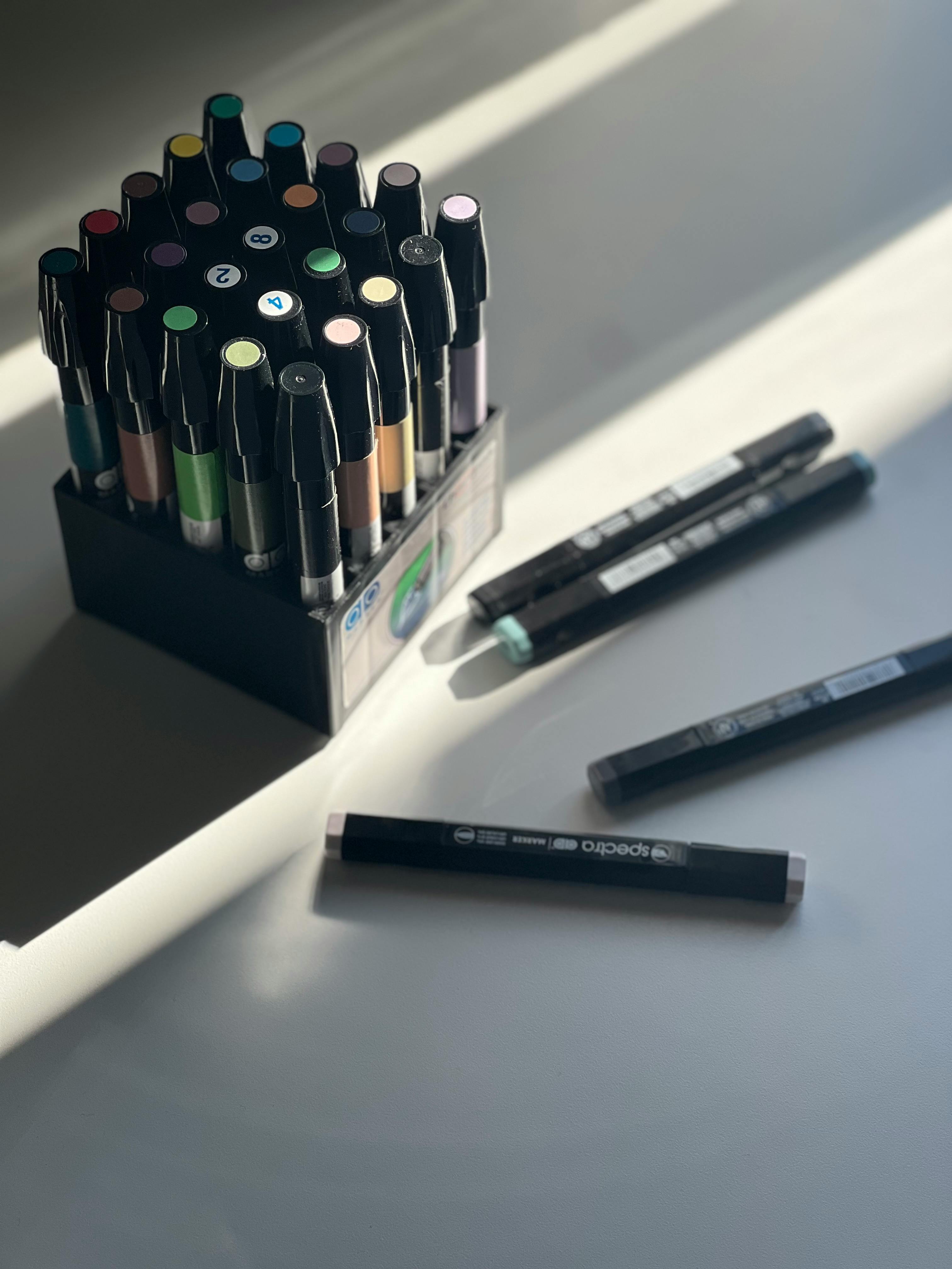 Set of Markers on Table · Free Stock Photo