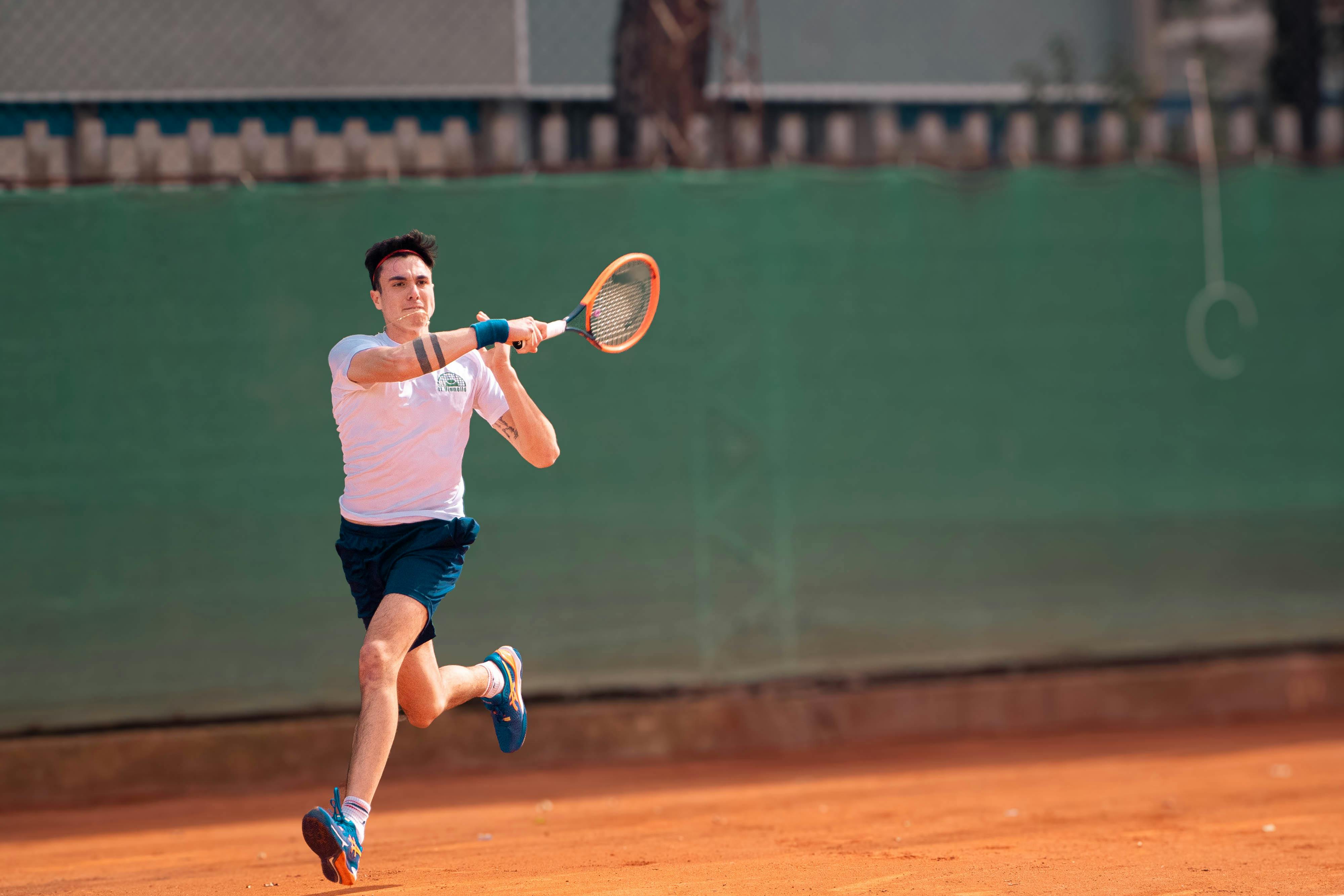 Man Running and Playing Tennis · Free Stock Photo