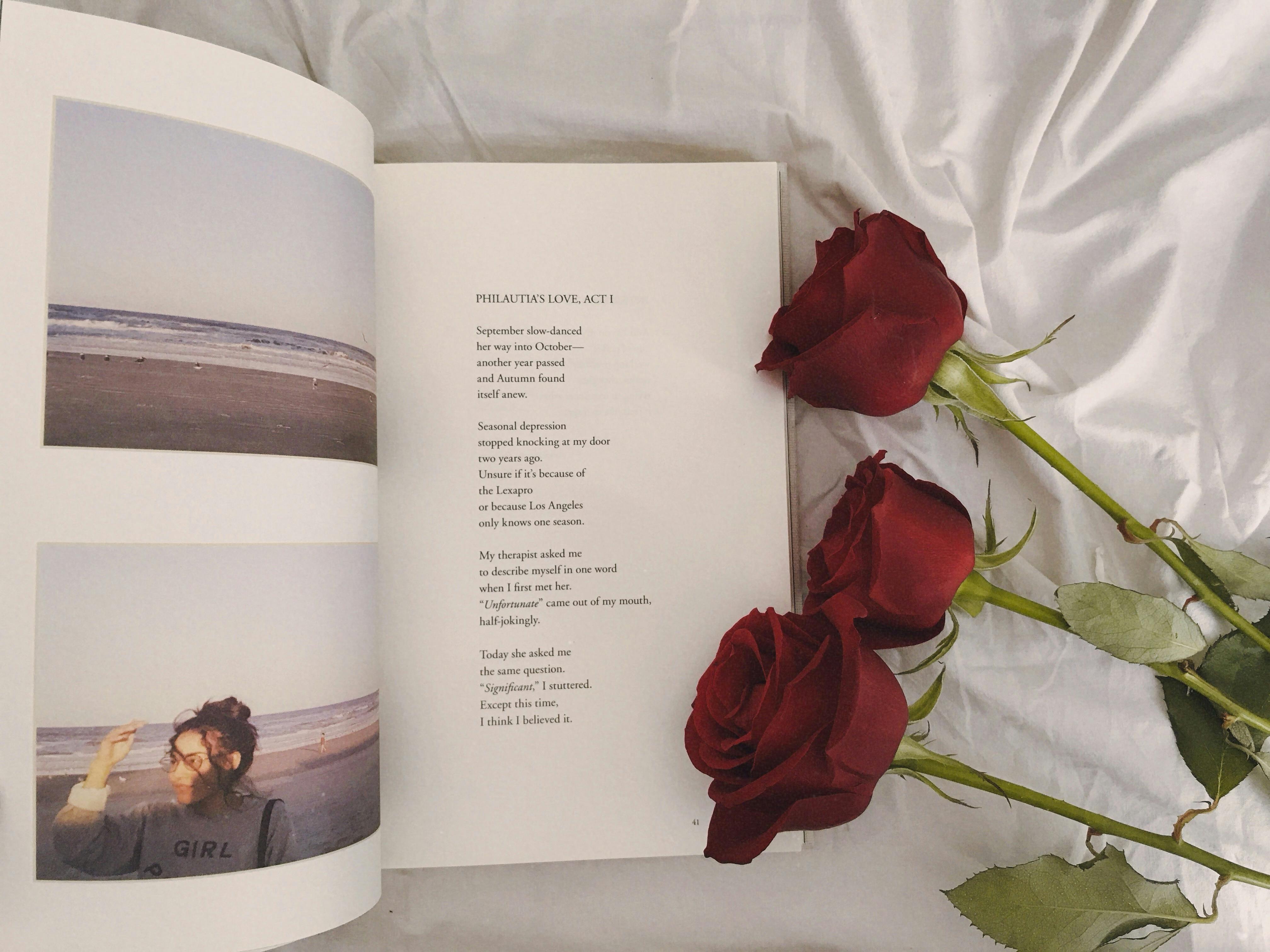 Open Book with Pictures and Poem next to Red Roses · Free Stock Photo