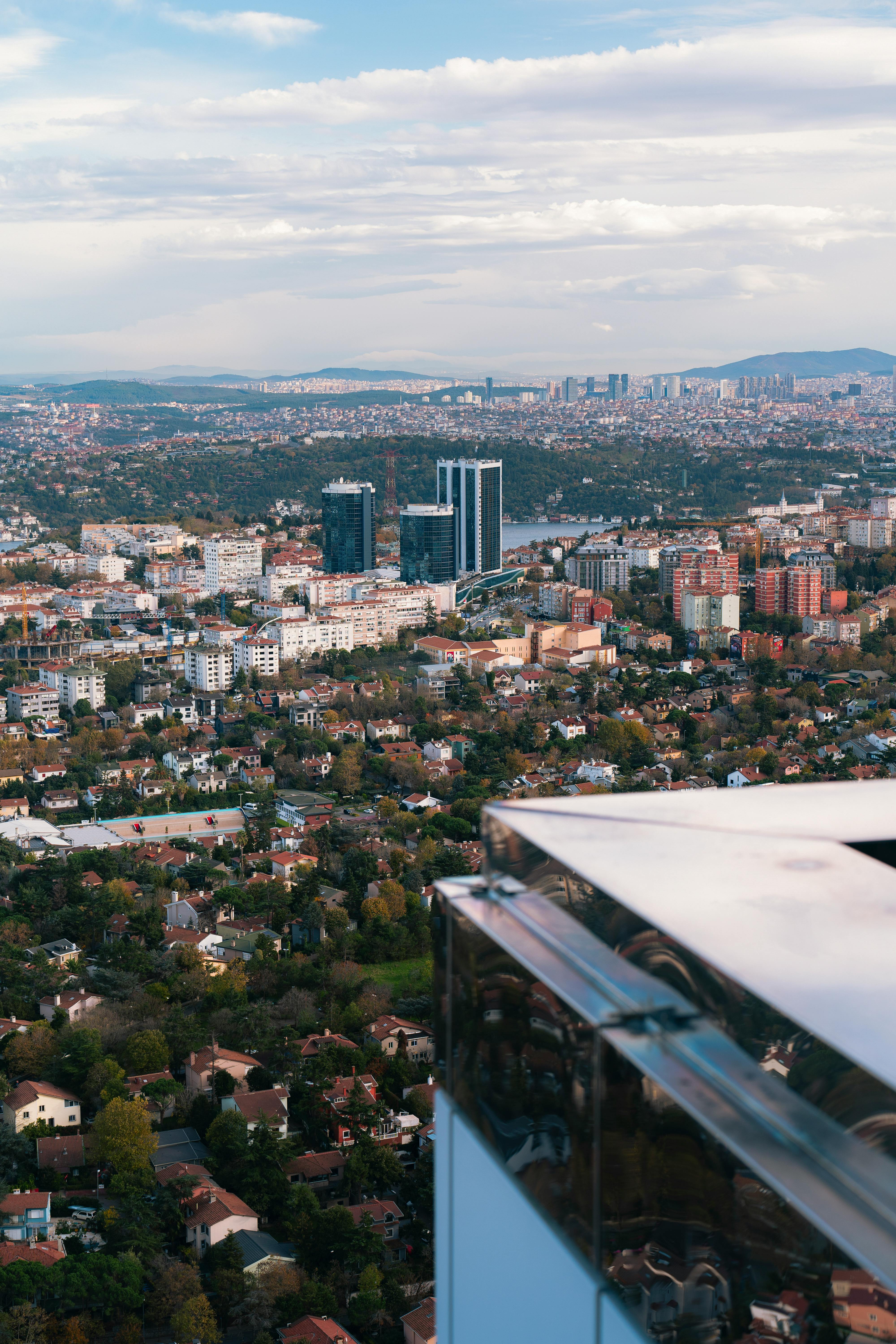 Aerial View of Brown Buildings Under Blue and White Sky · Free Stock Photo