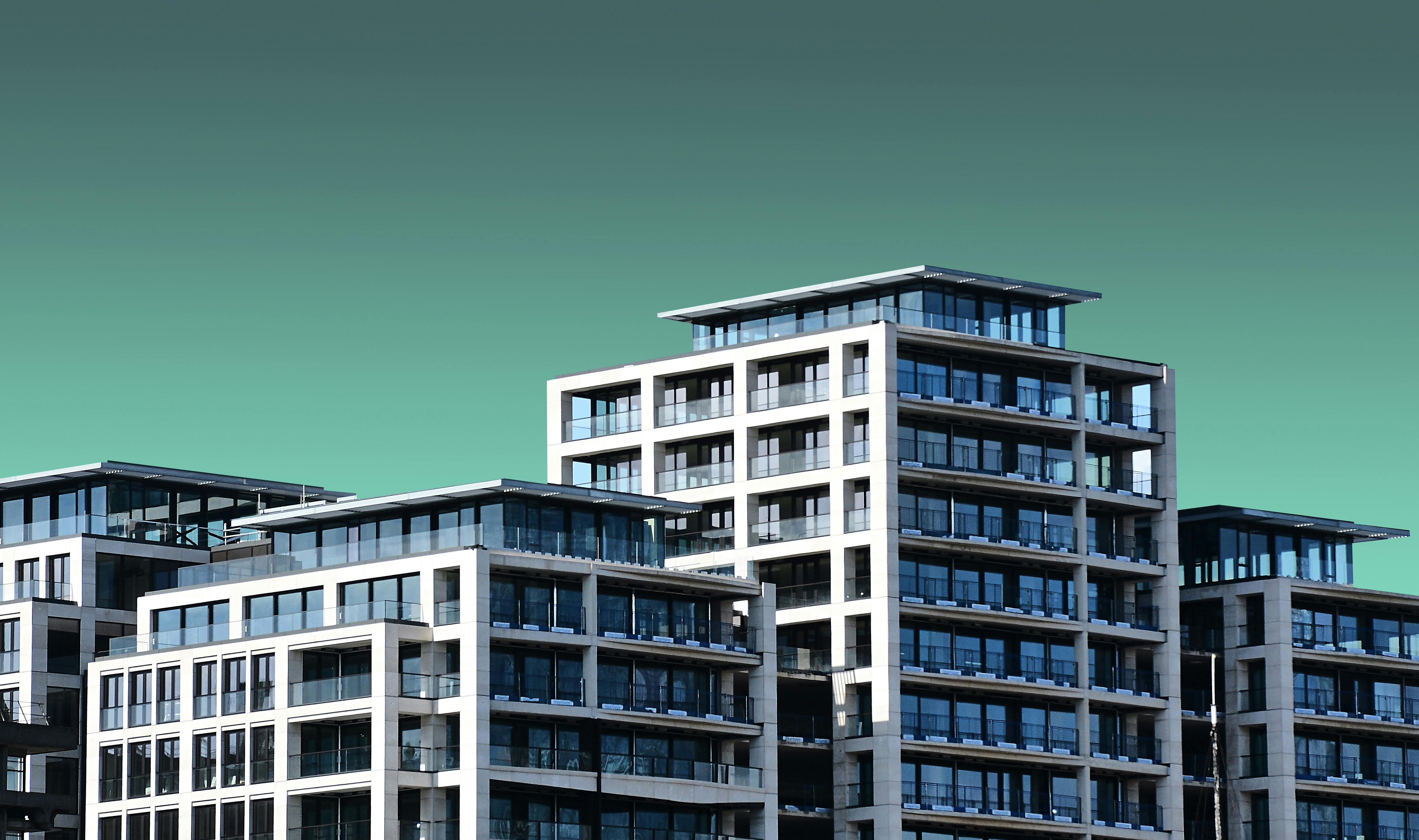 Low-angle Photography of Beige Concrete Building · Free Stock Photo