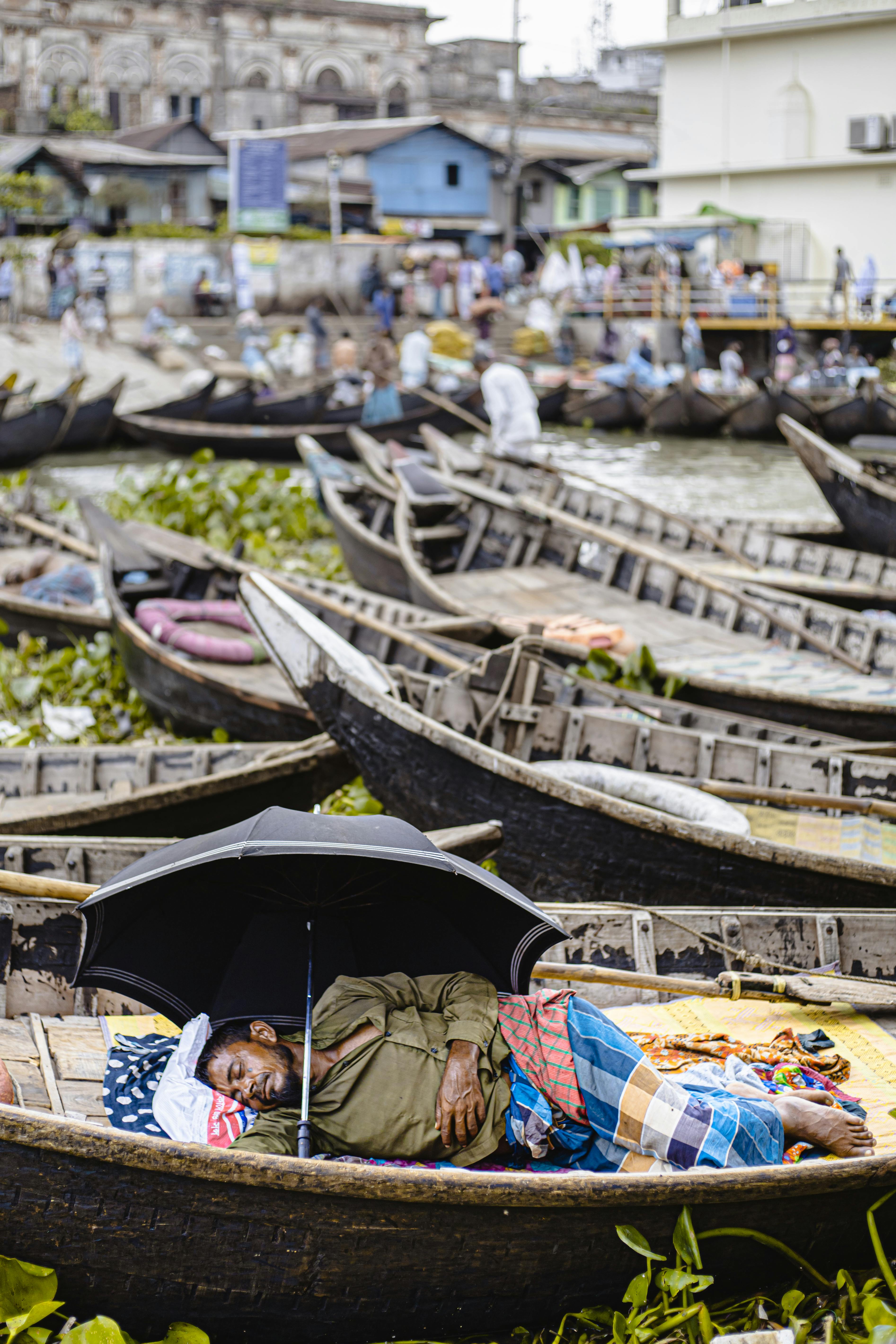 A Man Sleeping in a Boat · Free Stock Photo