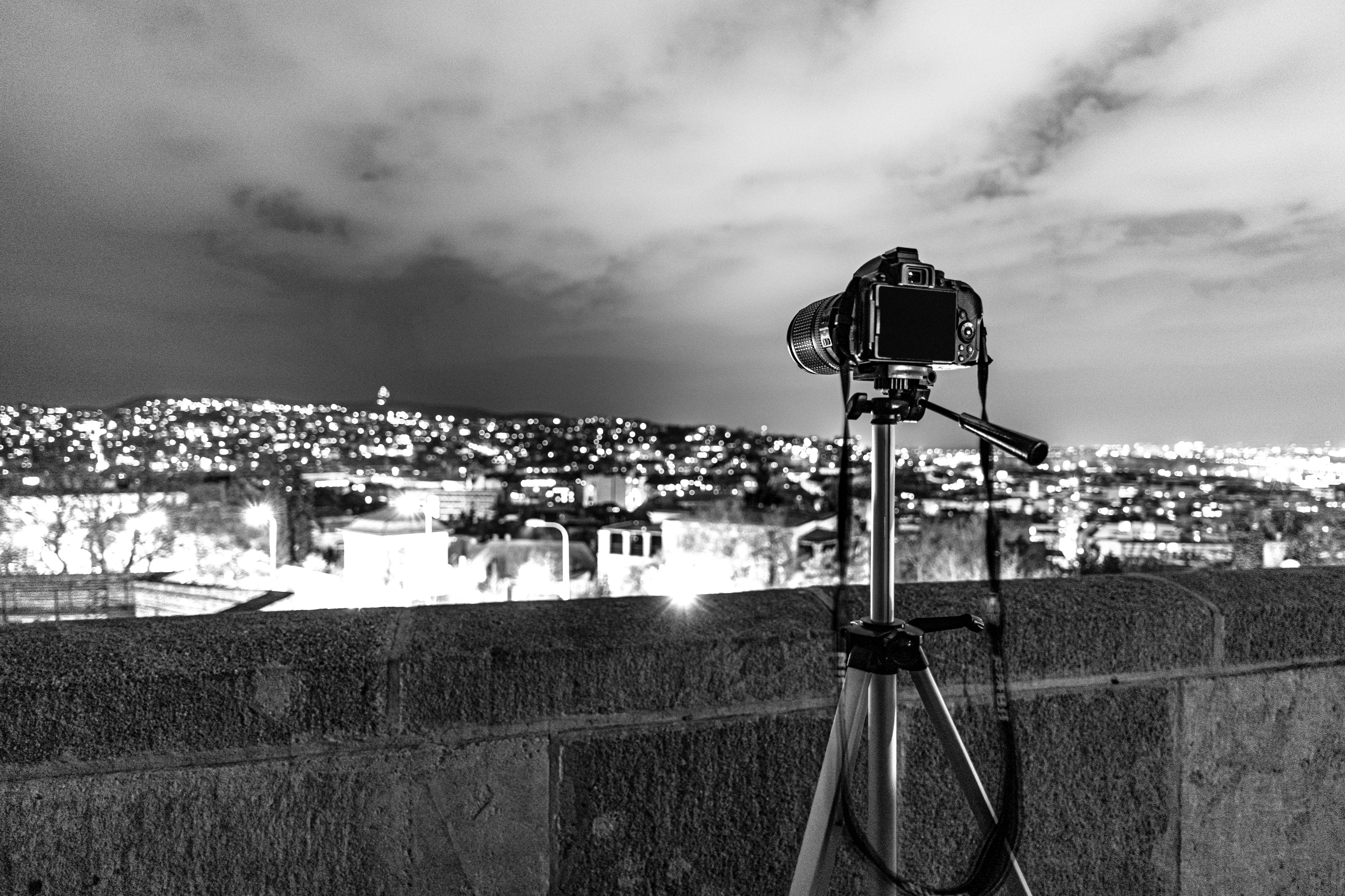 tripod and a nikon camera at night · Free Stock Photo