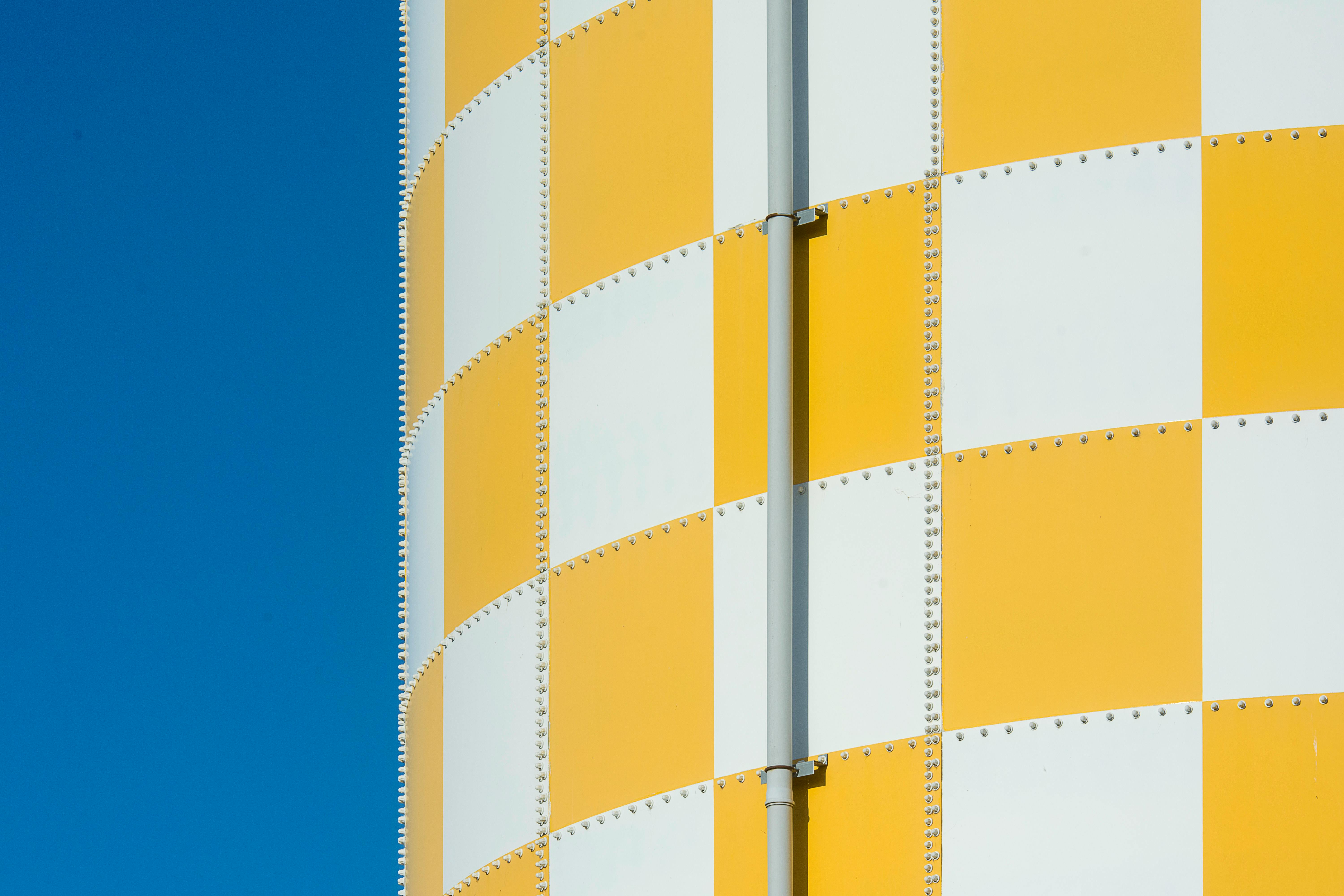 Top view Of A Yellow Flat Metal On A Dark Gray Surface · Free Stock Photo