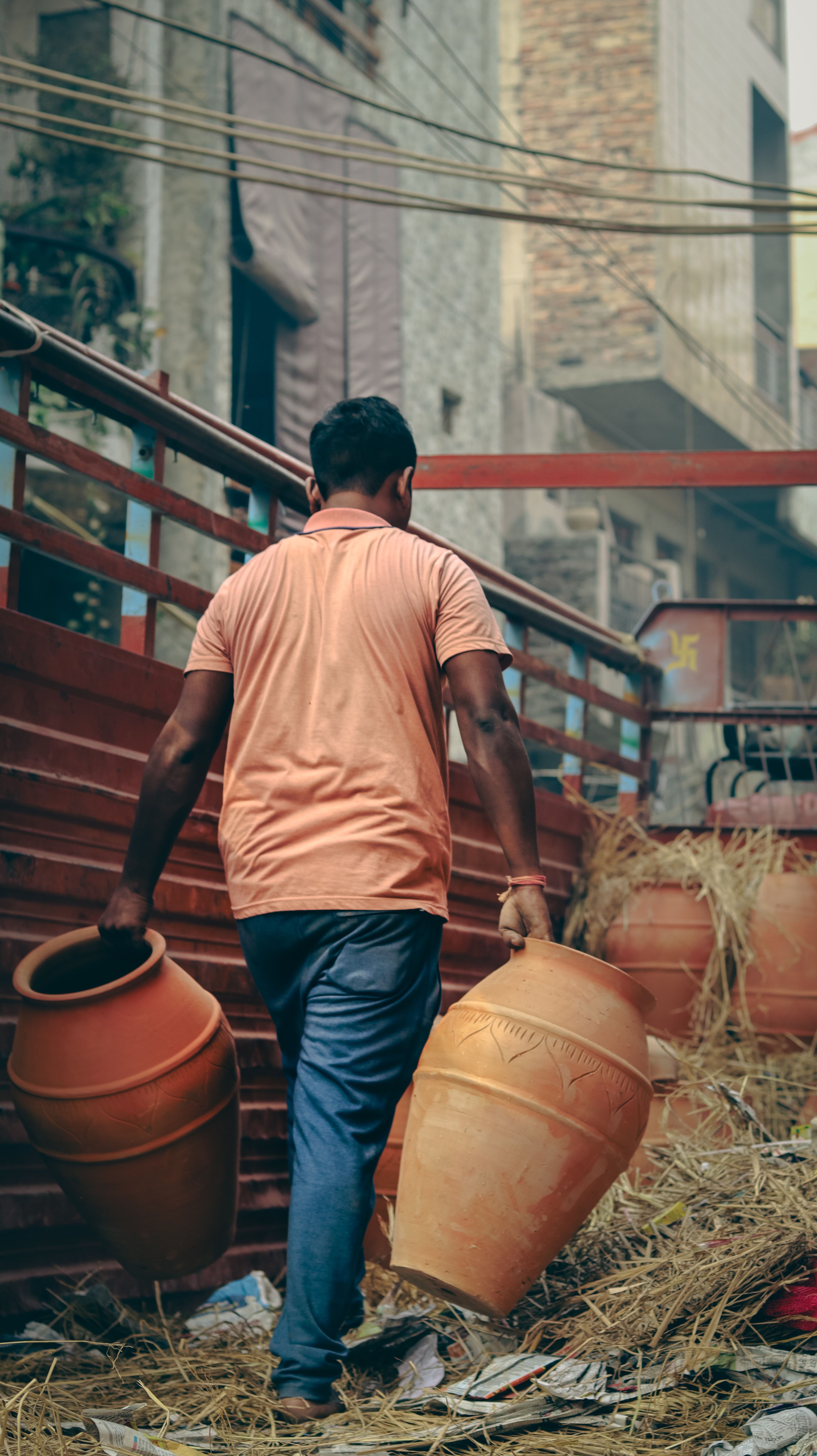 Man Carrying Large Clay Vases · Free Stock Photo