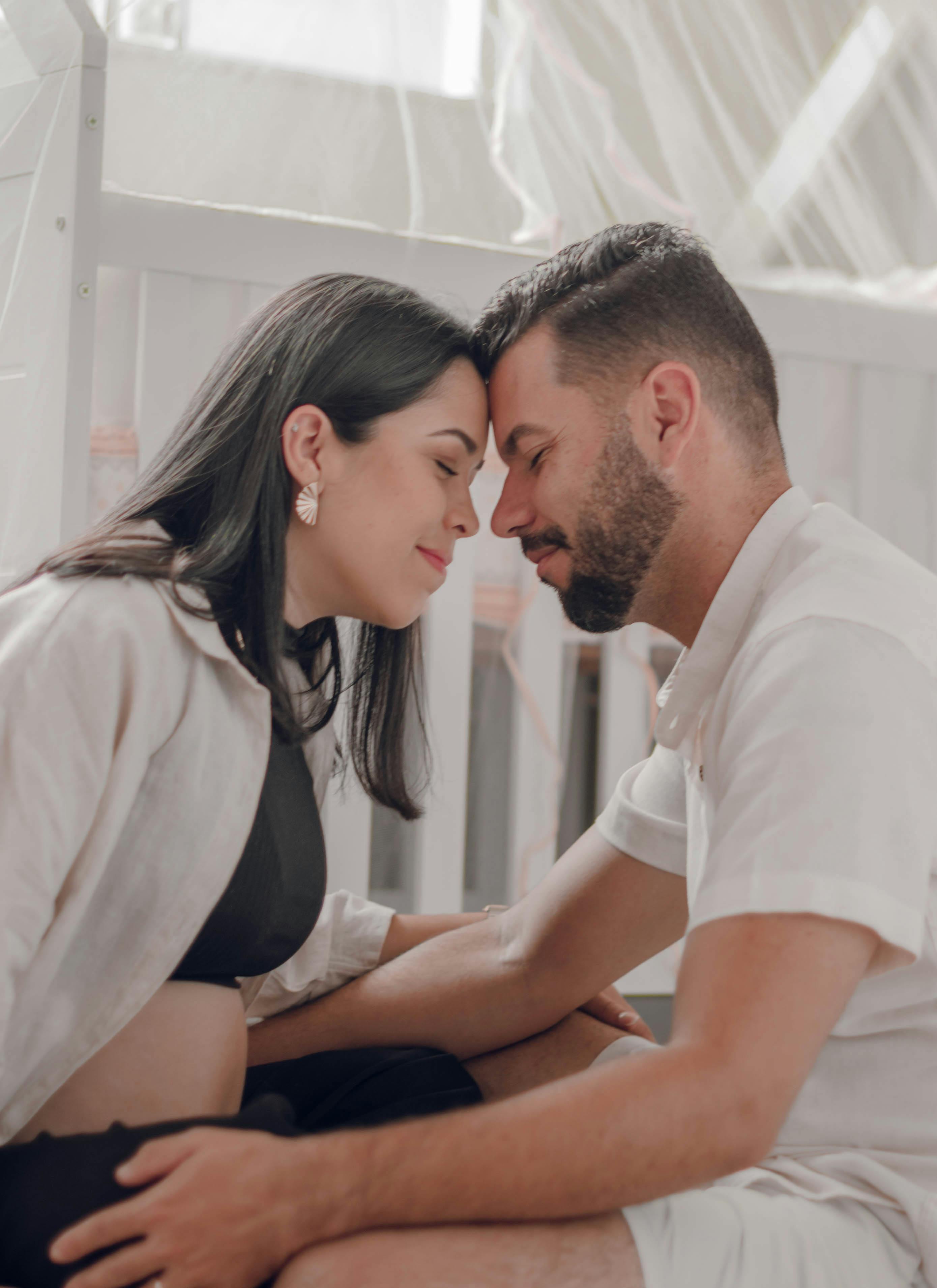 Couple Sitting with their Foreheads Touching · Free Stock Photo