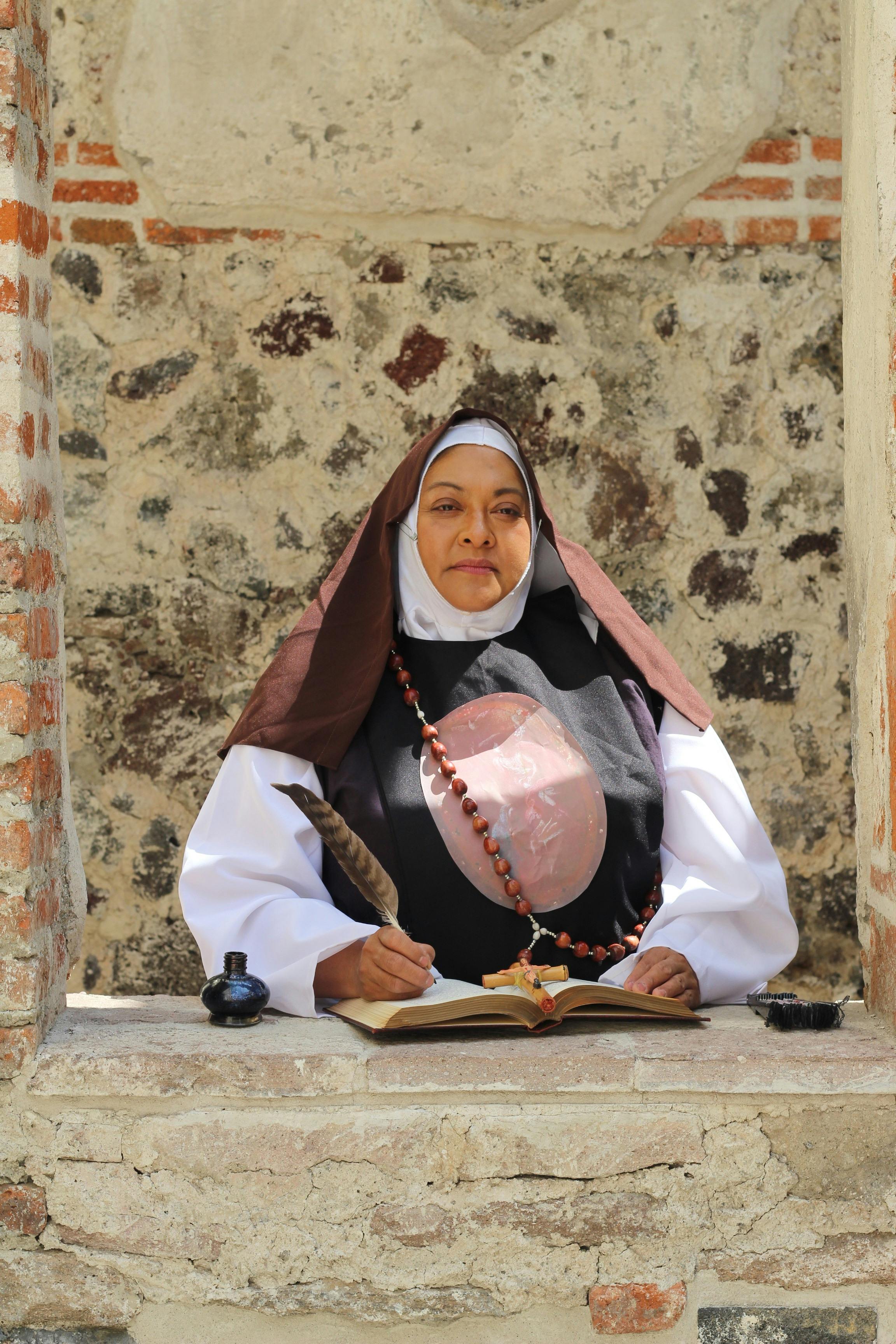 Portrait of Nun Standing with Bible · Free Stock Photo