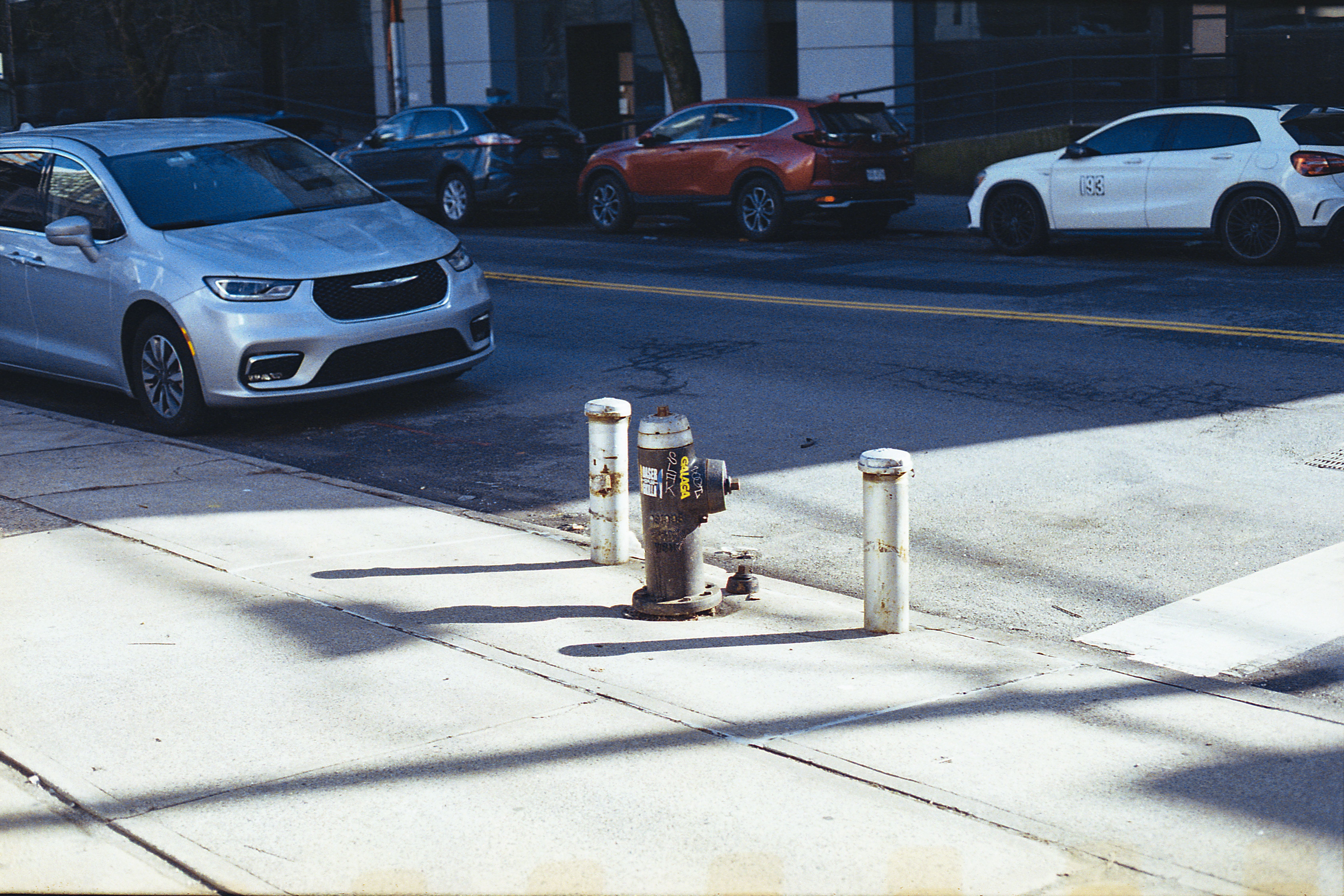 City Street with Cars and Hydrants · Free Stock Photo