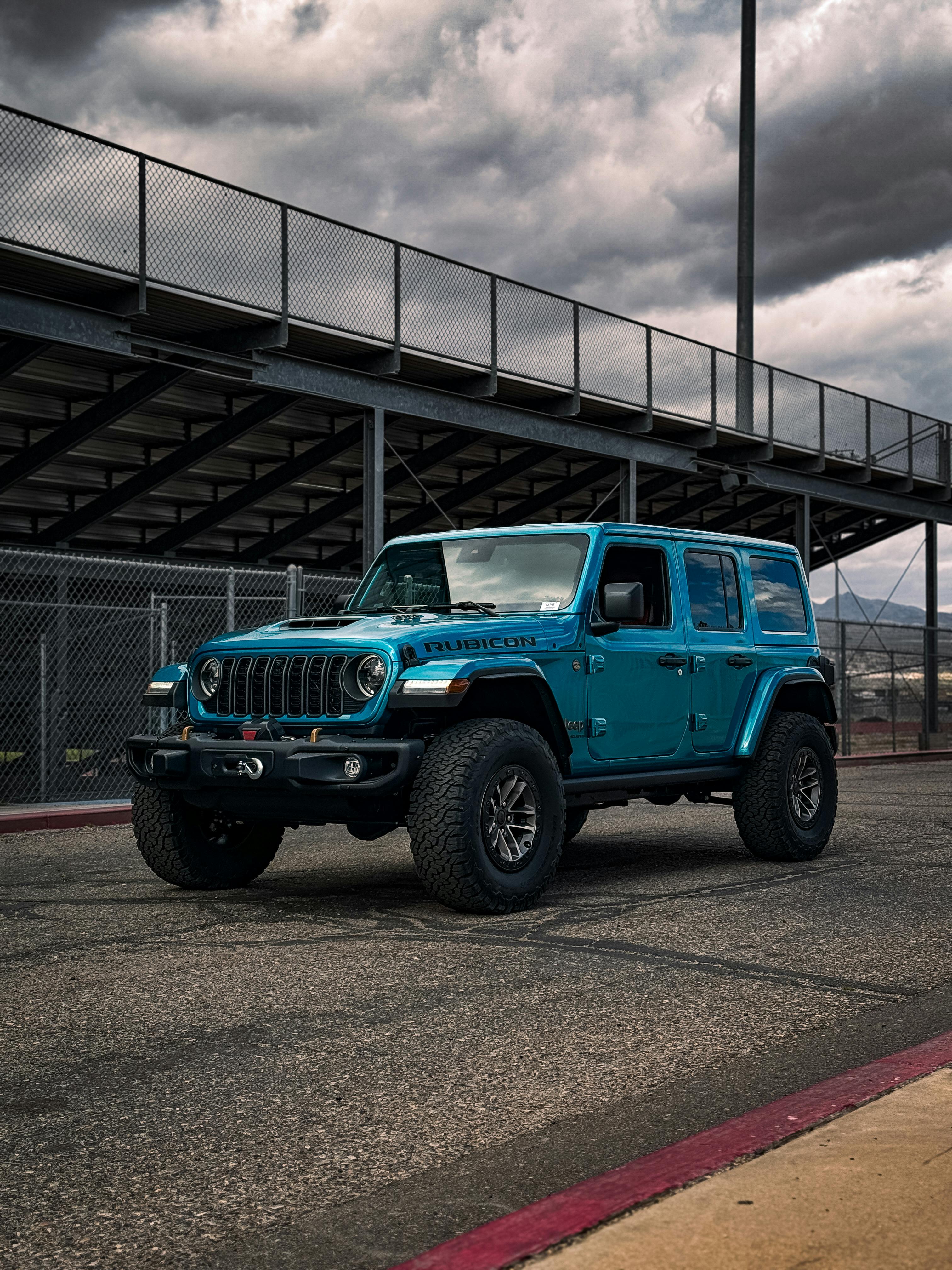 Blue Tuck by a Stadium · Free Stock Photo