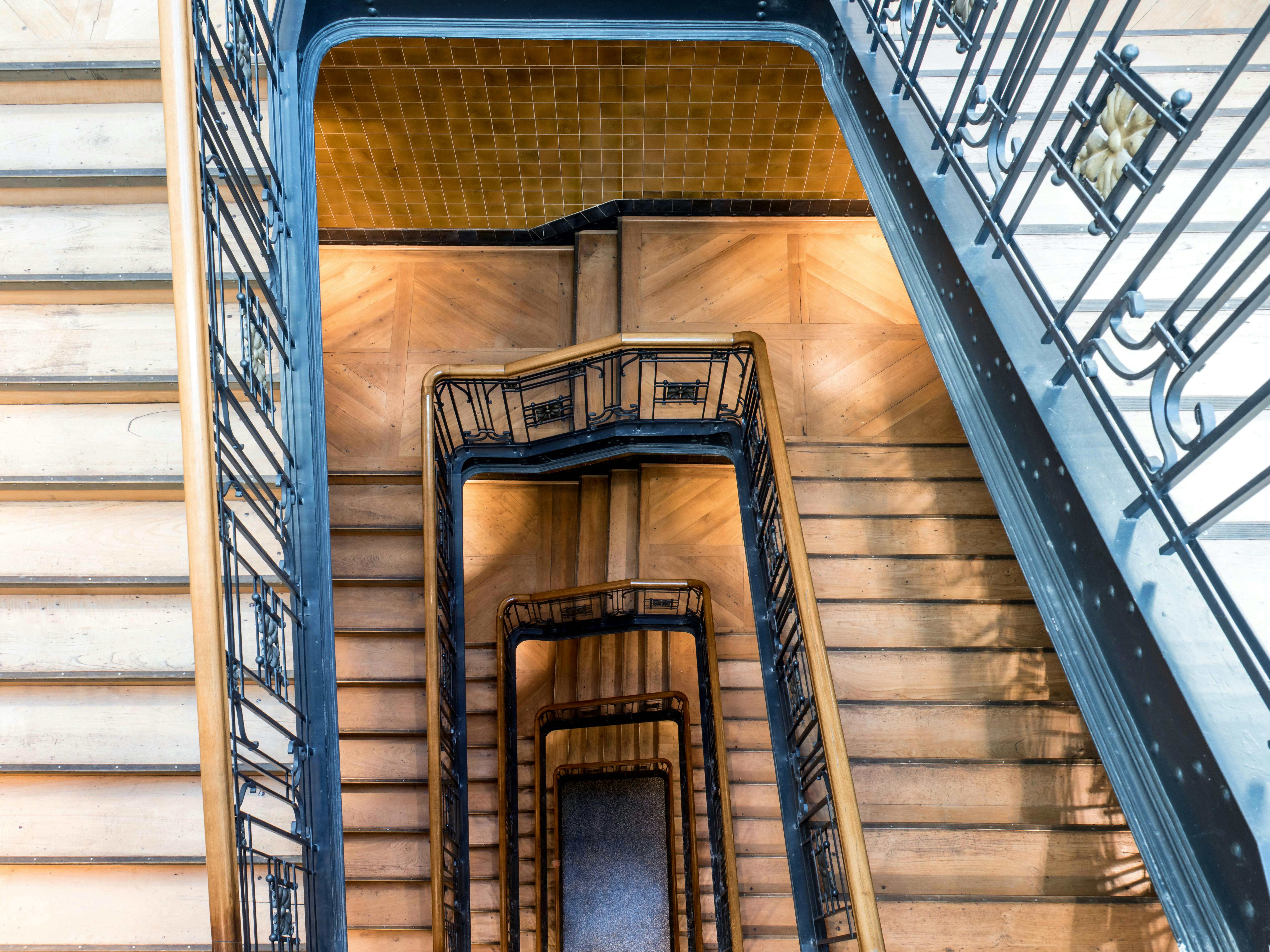 Top View of Staircase with Ornate Railing · Free Stock Photo