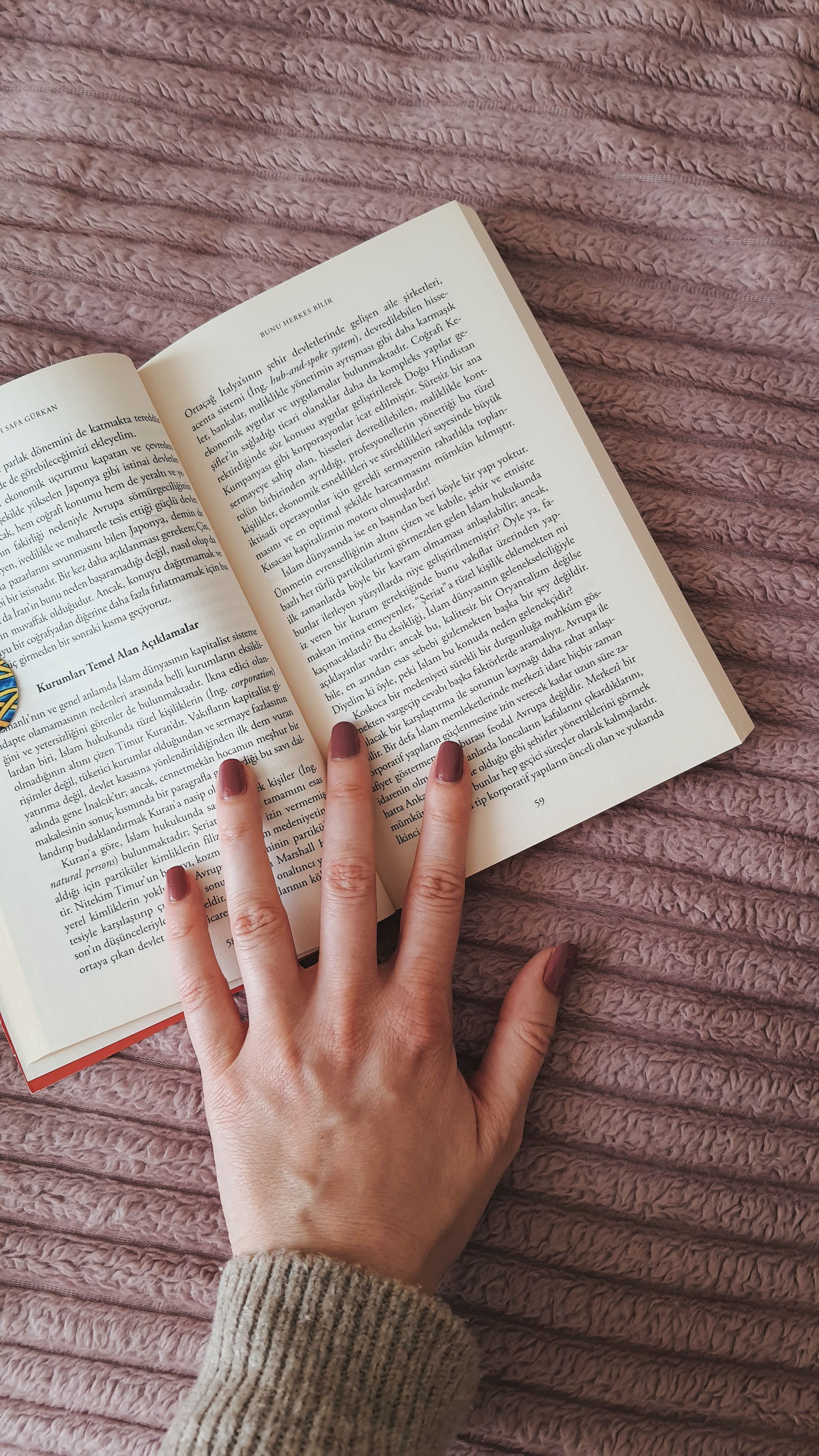 Book in pink binding among papers · Free Stock Photo
