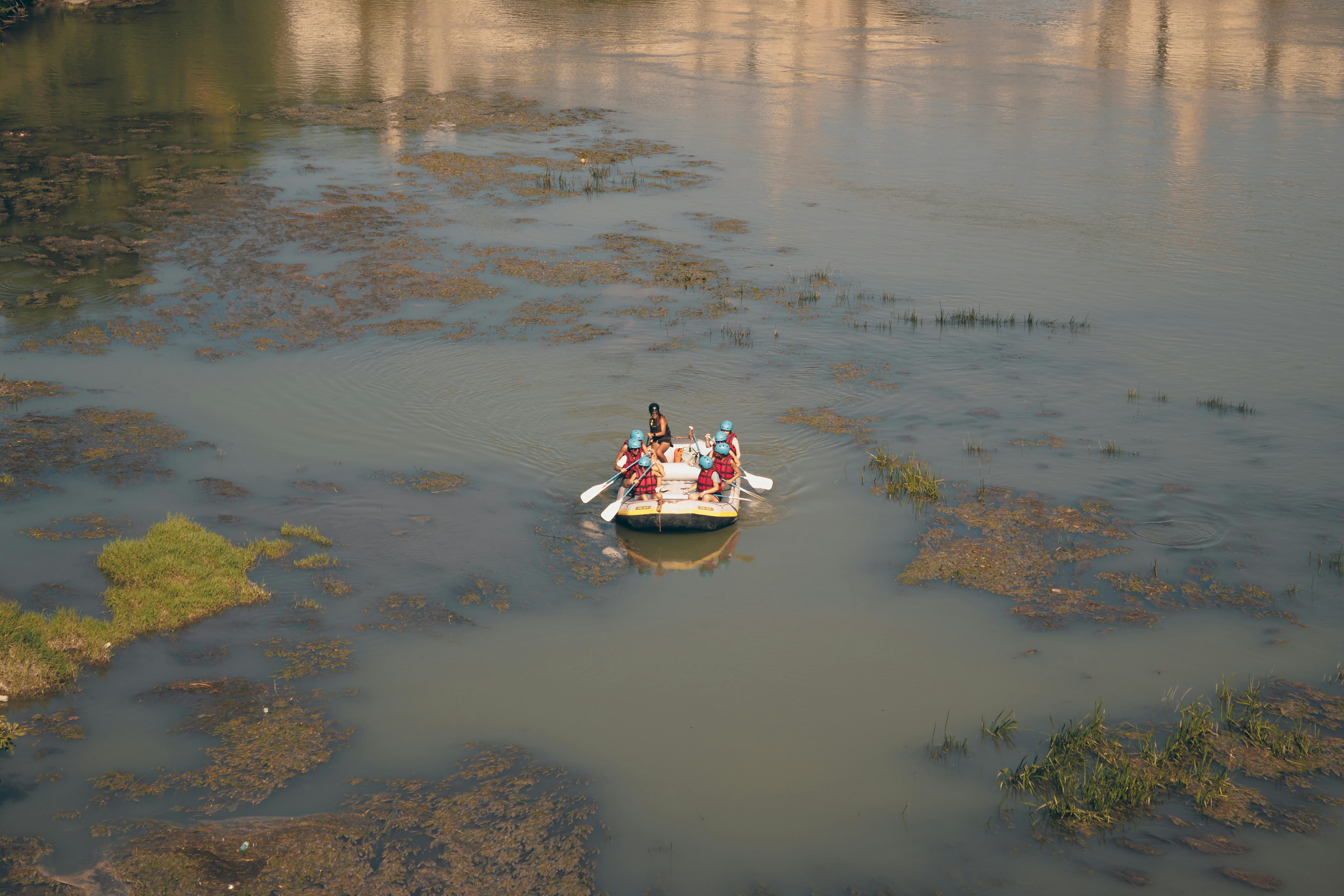 People Rowing on Pontoon on Lake · Free Stock Photo