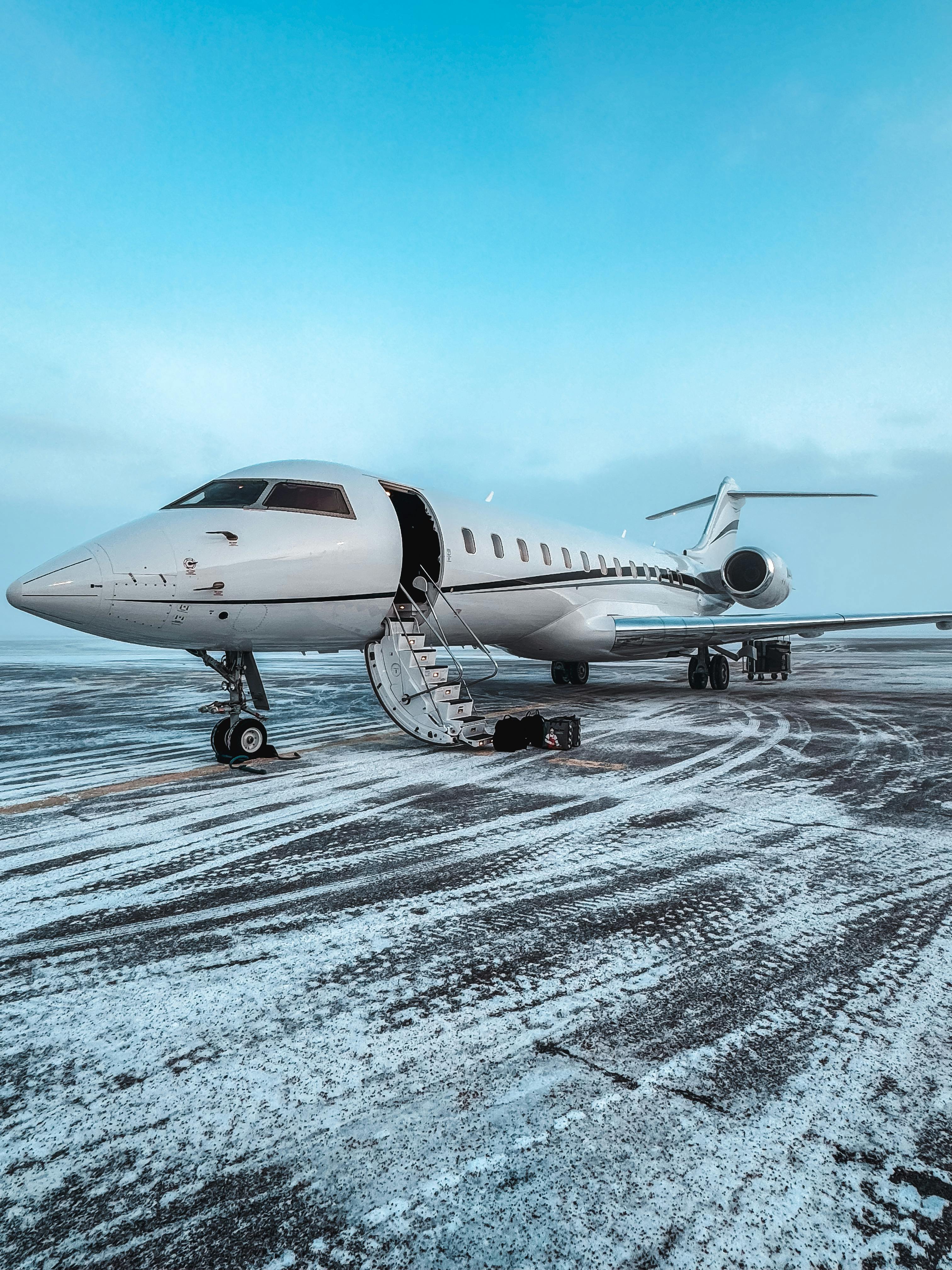 Jet at a Snowy Airport · Free Stock Photo