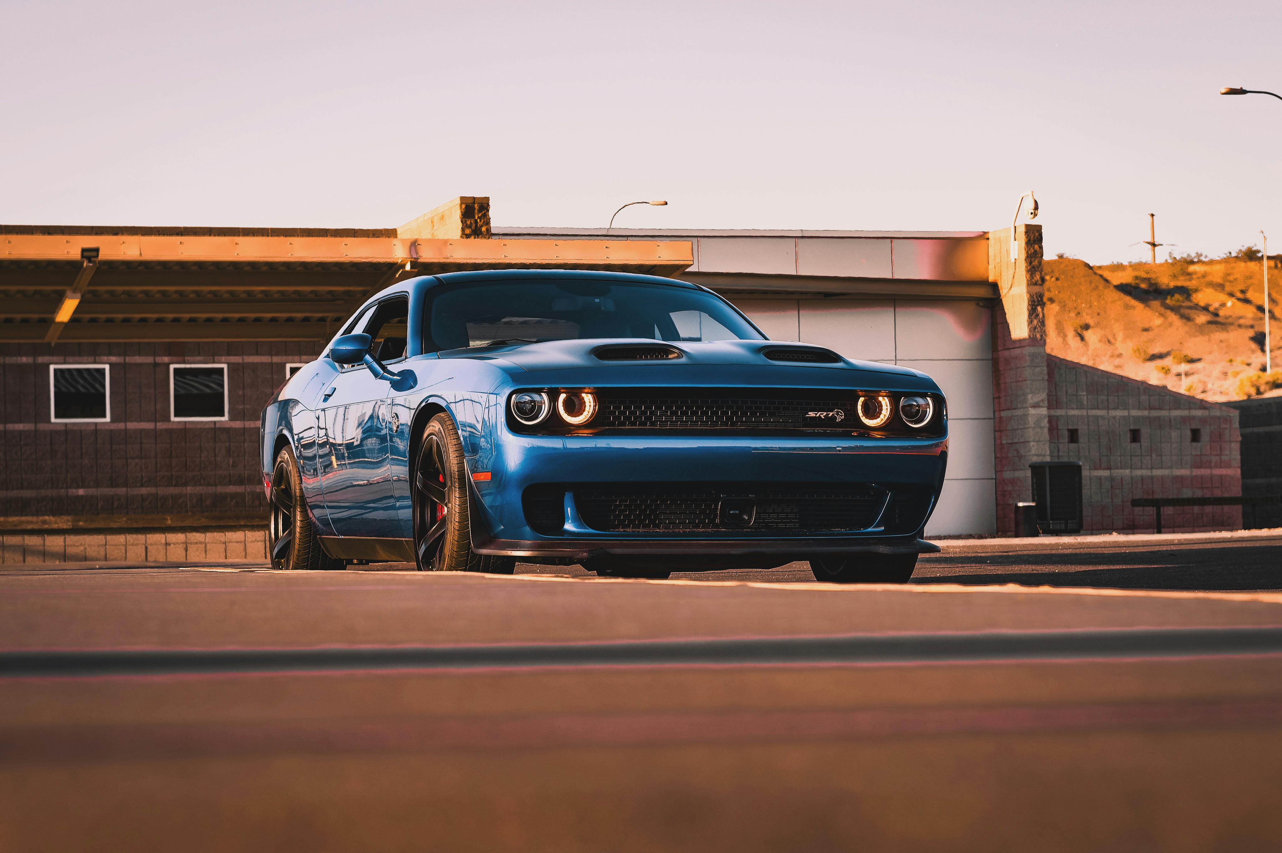 A blue dodge challenger parked on the street · Free Stock Photo