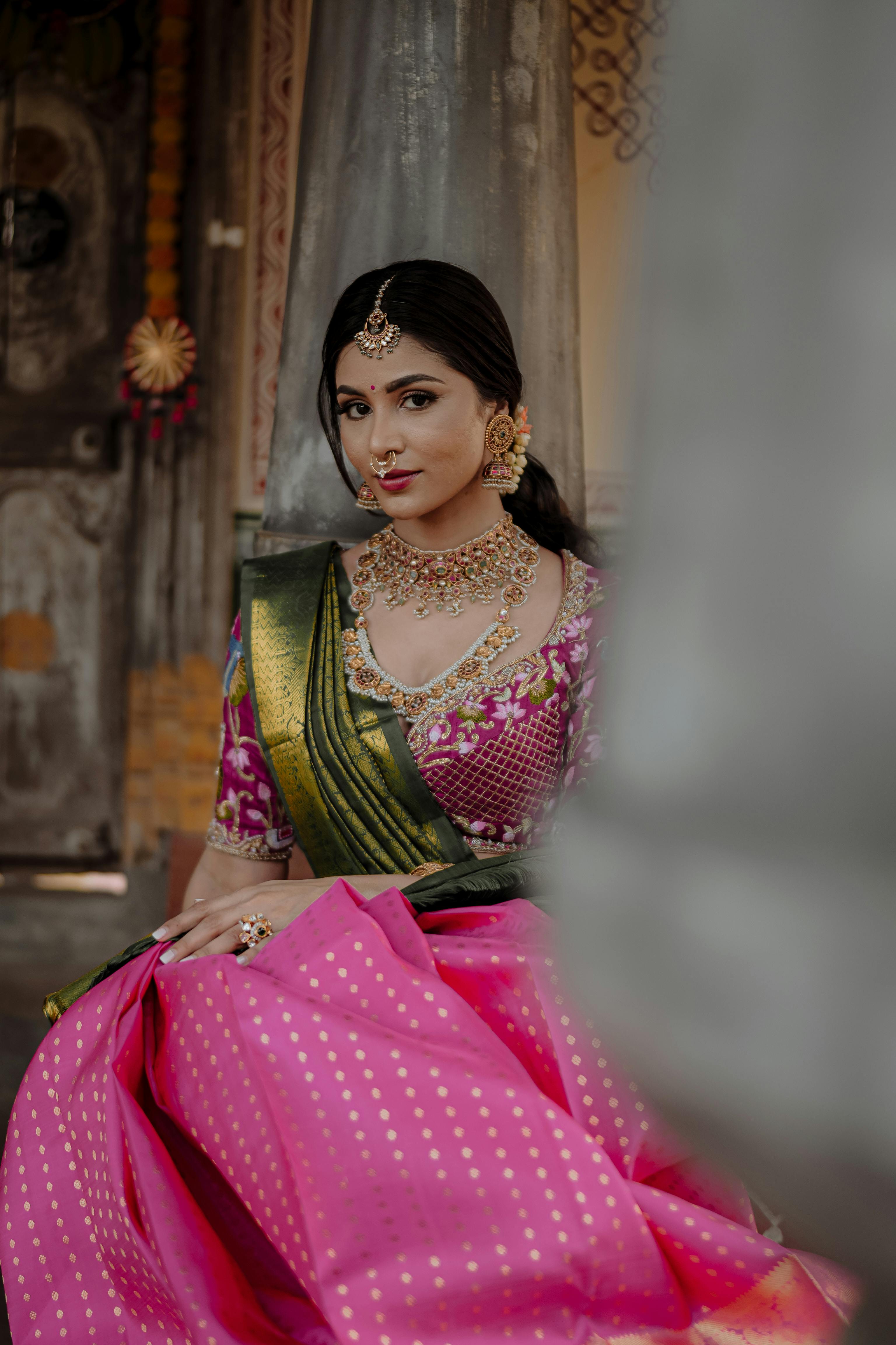 Hindu Bride in Traditional Pink Wedding Dress Sitting · Free Stock Photo