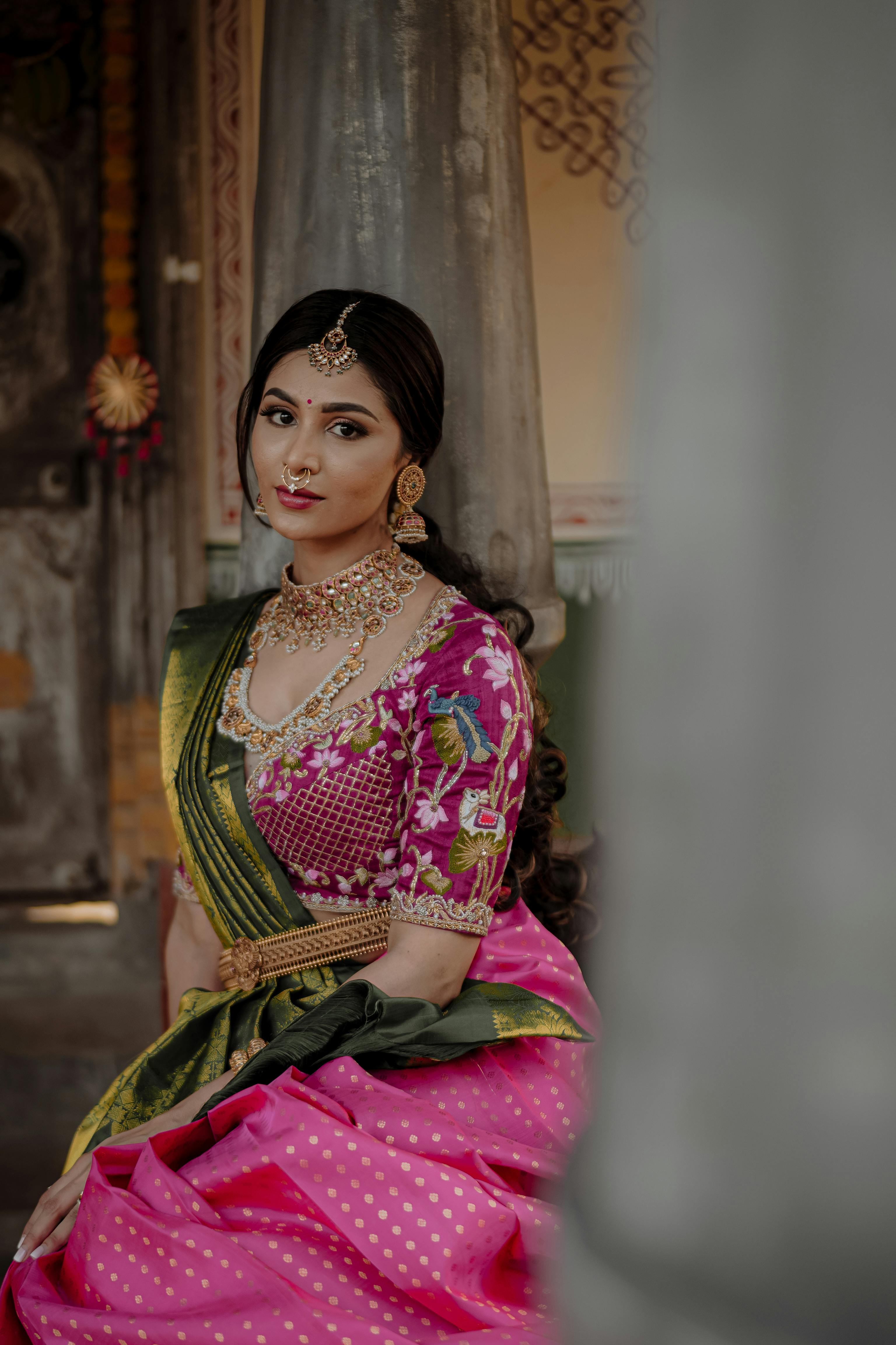 Portrait of a Beautiful Brunette Wearing an Ornate Sari · Free Stock Photo