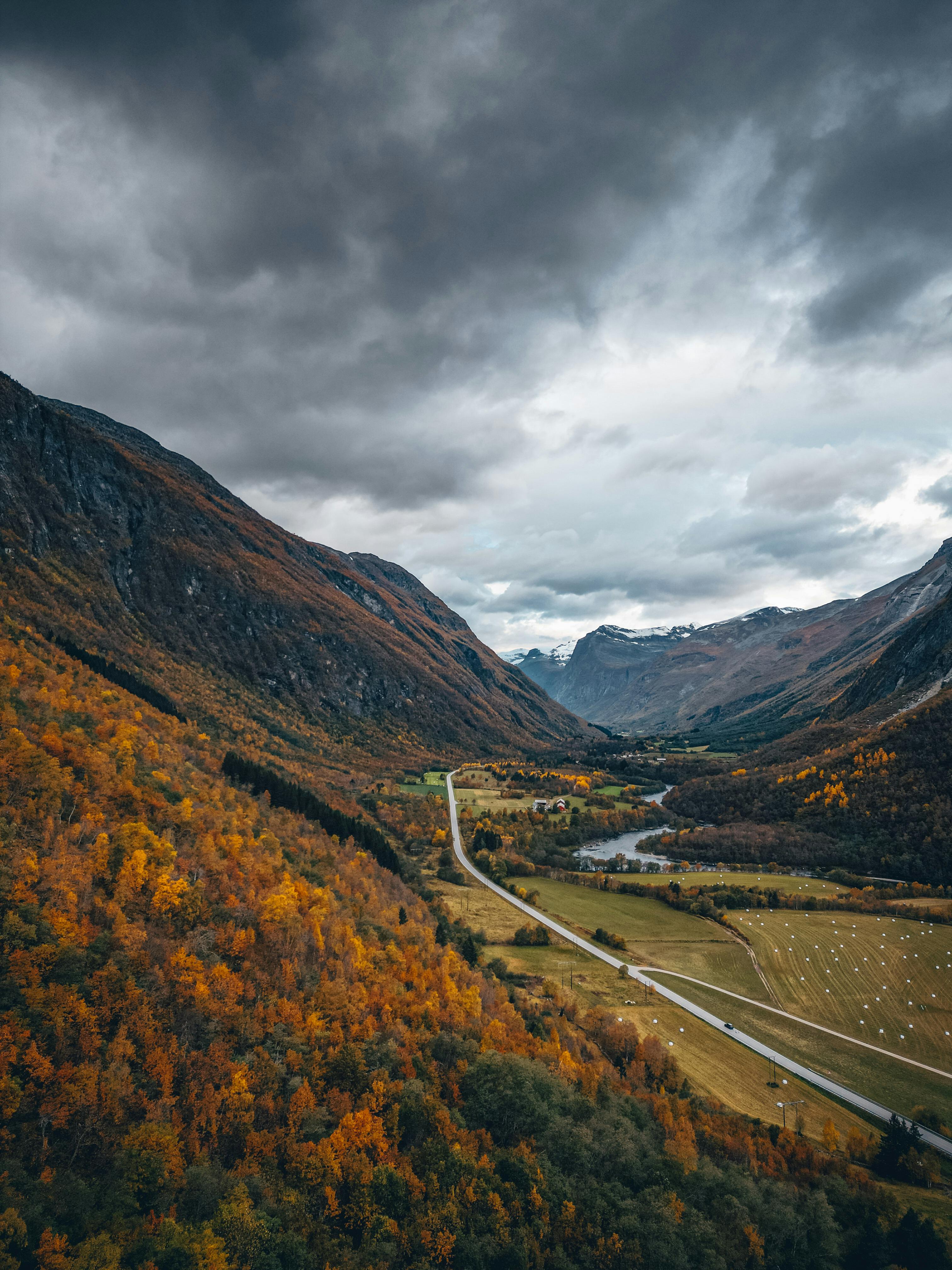 Road between Mountains During Fall · Free Stock Photo
