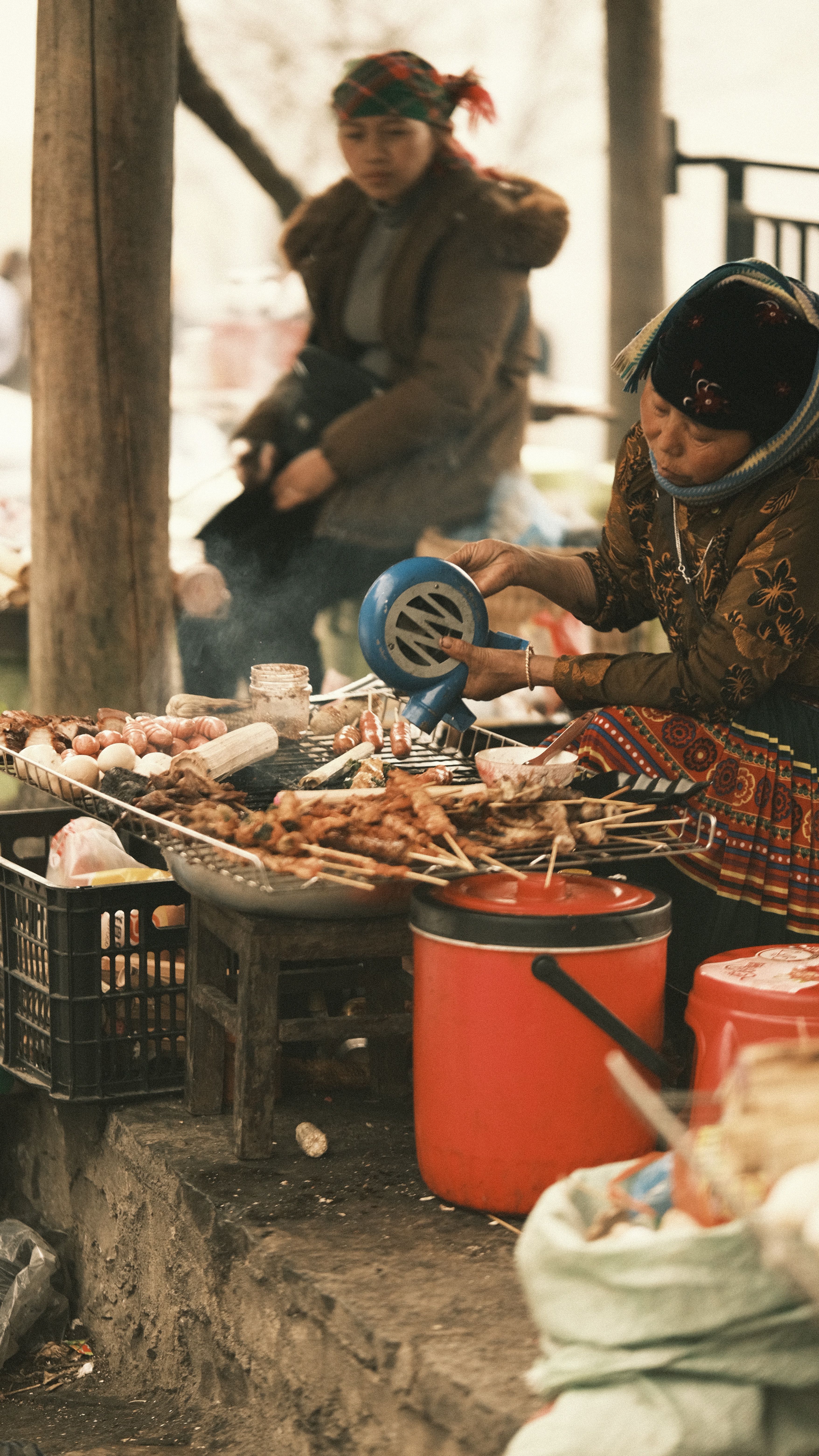 Women Sitting and Roasting Food · Free Stock Photo