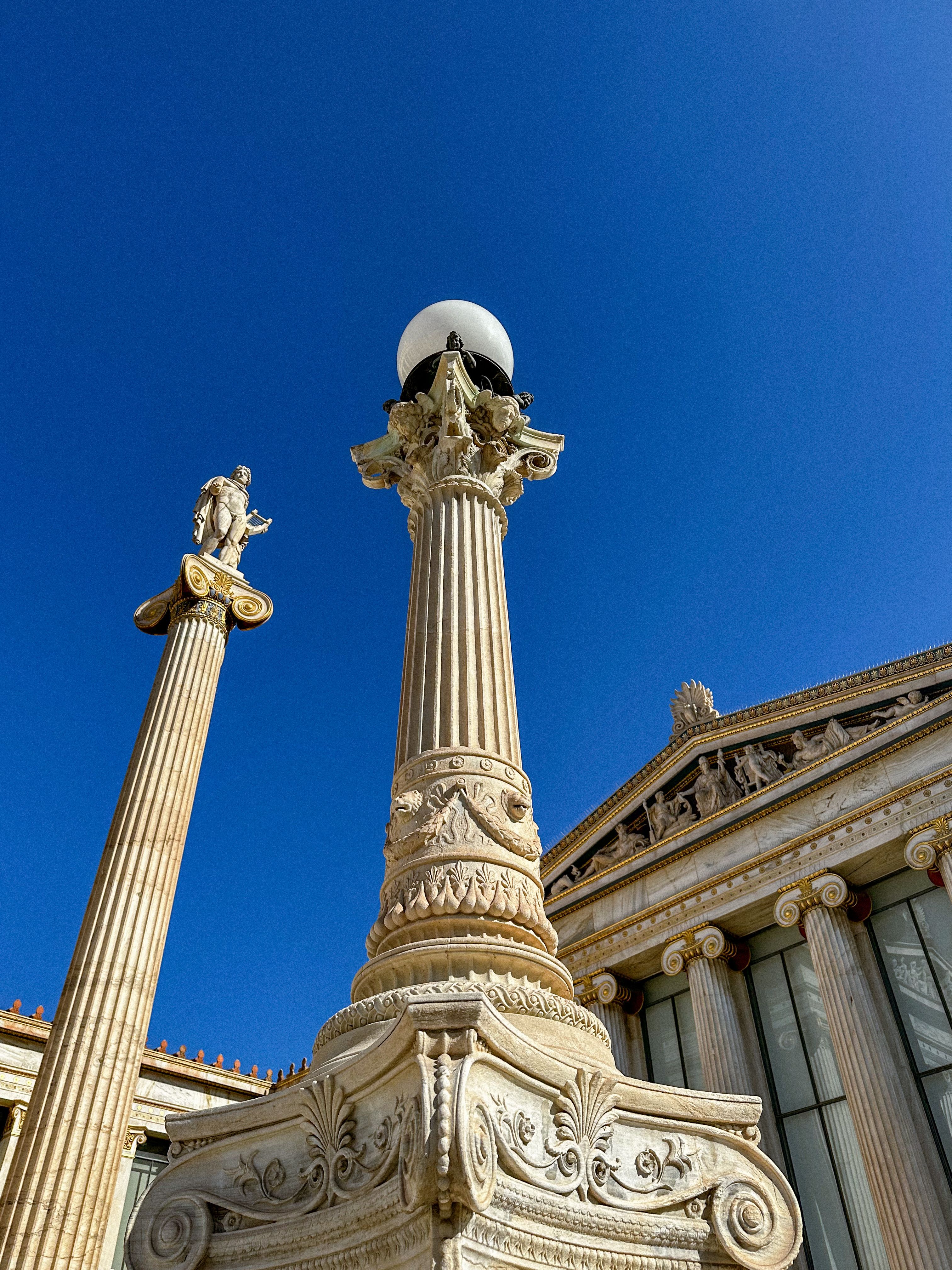 Columns with Statue and Lamp near Building · Free Stock Photo
