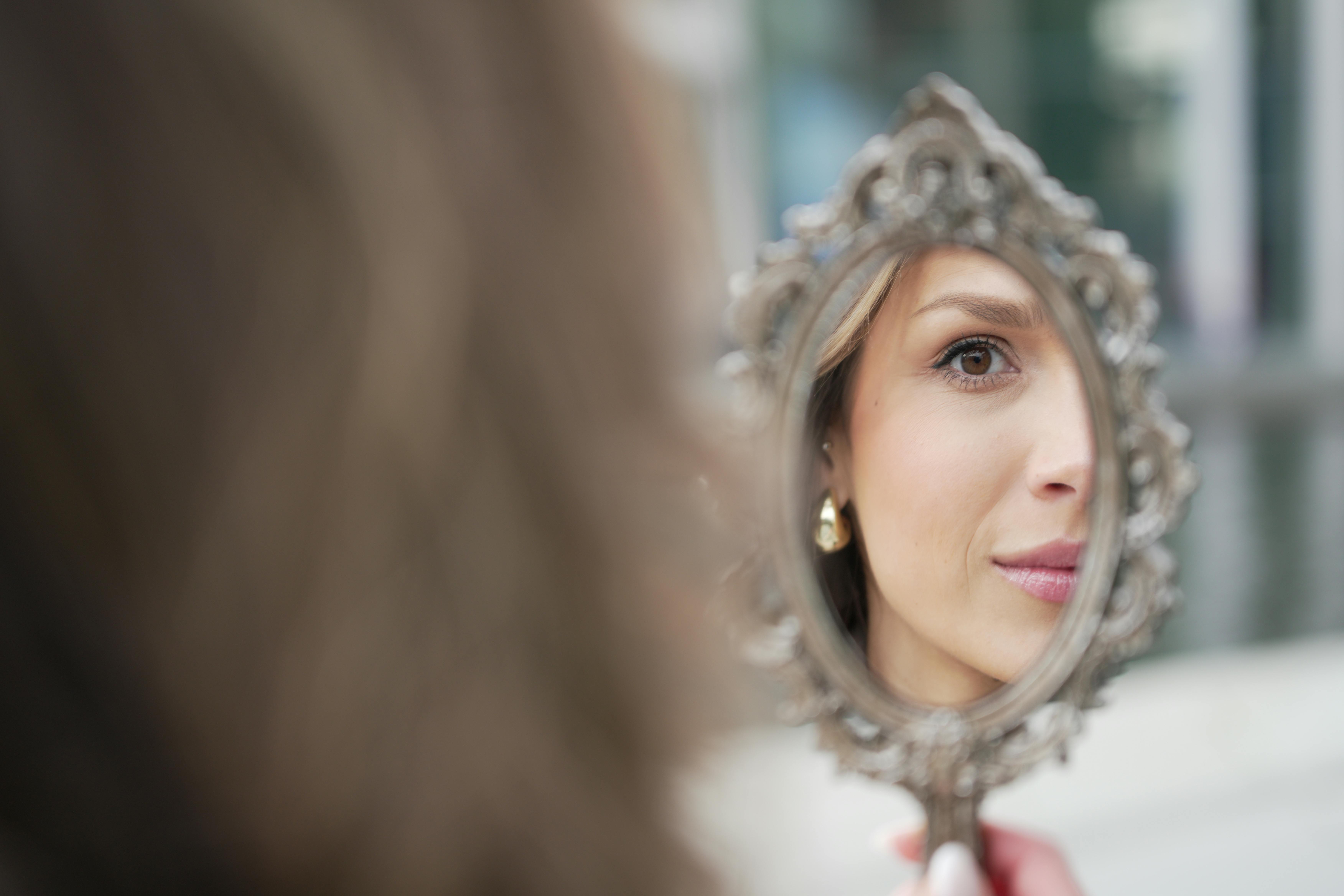 Reflection of Face in Vintage Mirror · Free Stock Photo