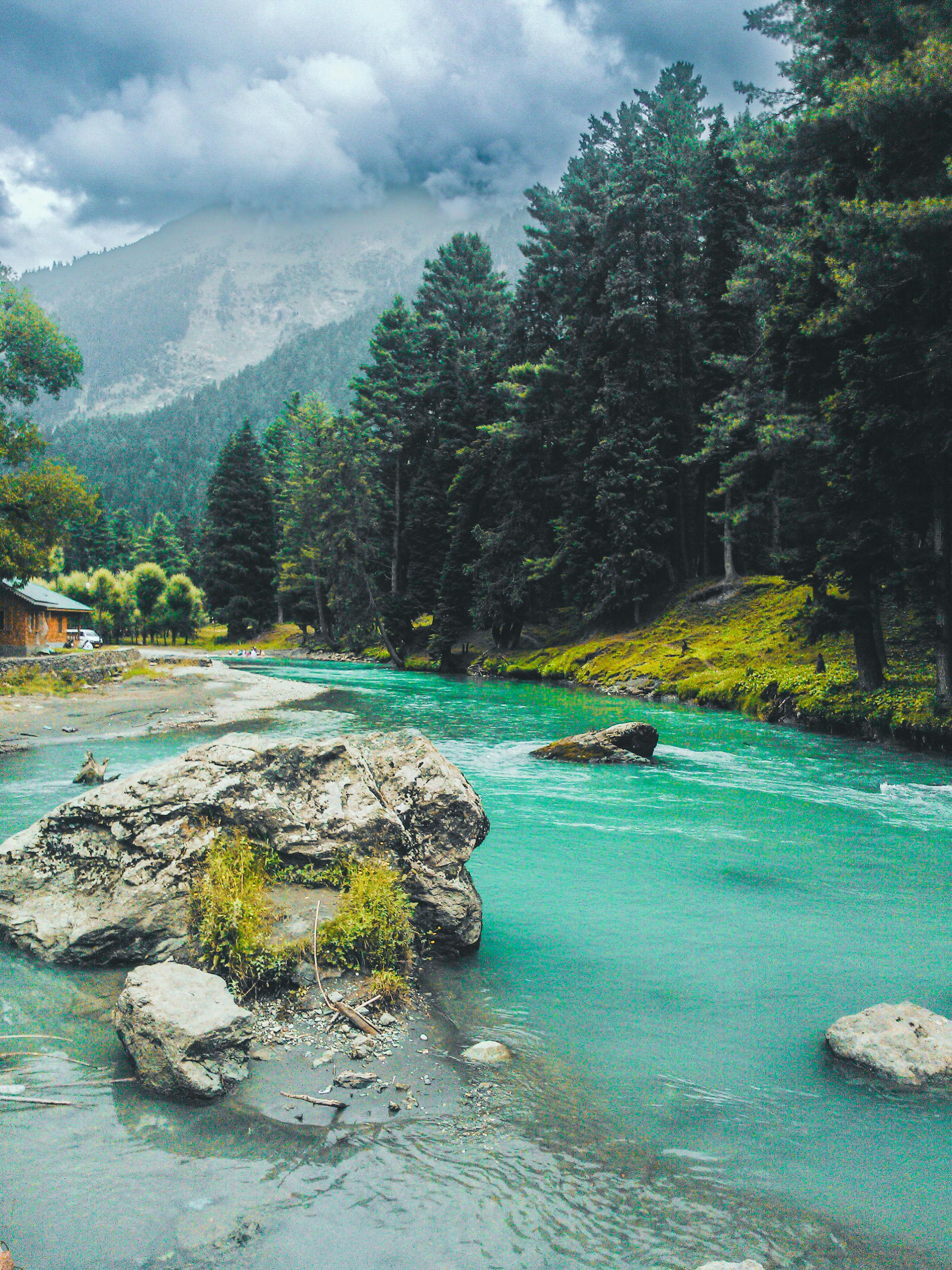 Scenic View of a Turquoise River Flowing in a Valley · Free Stock Photo