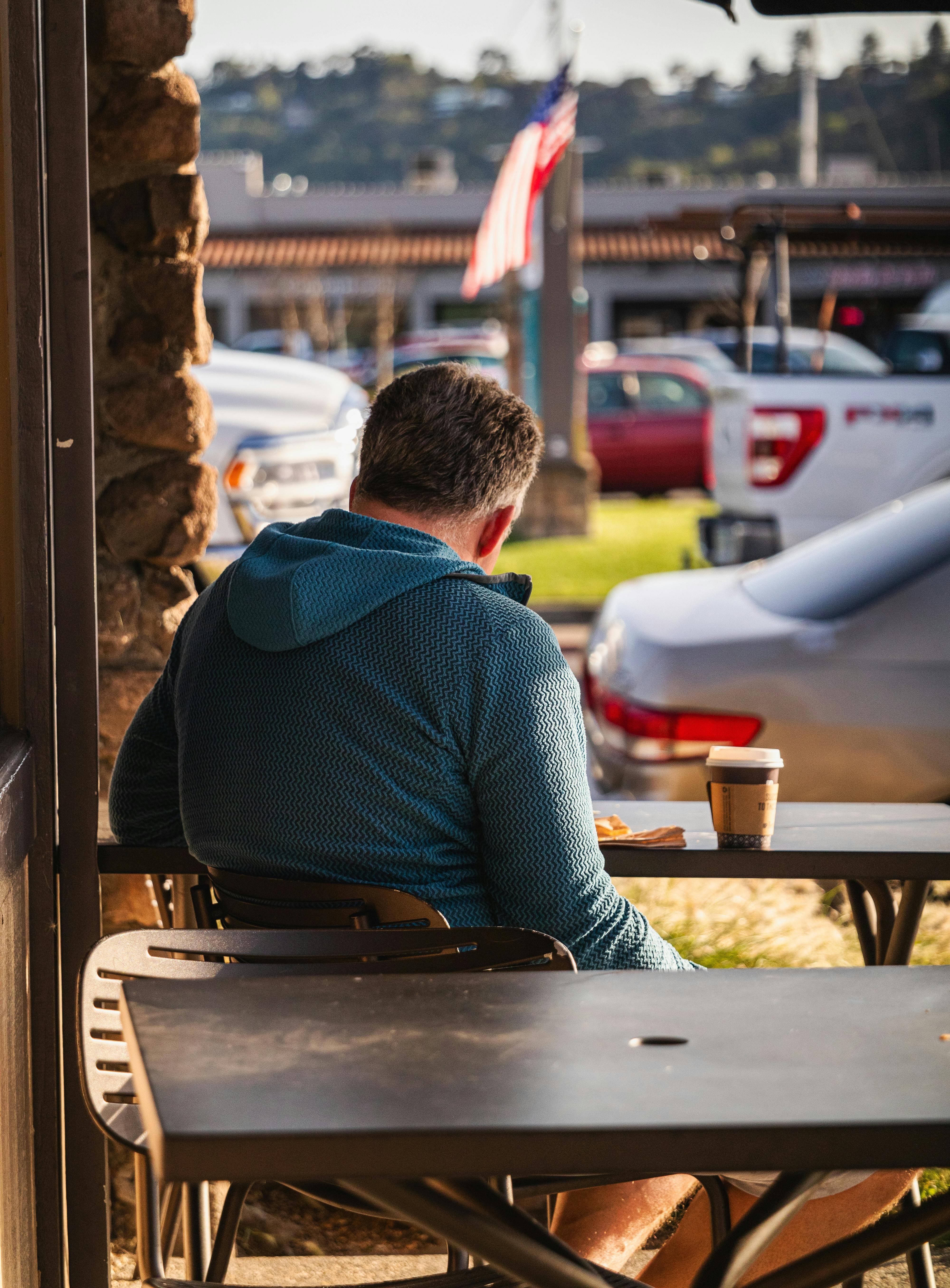 Back View of a Man Sitting in Cafe · Free Stock Photo
