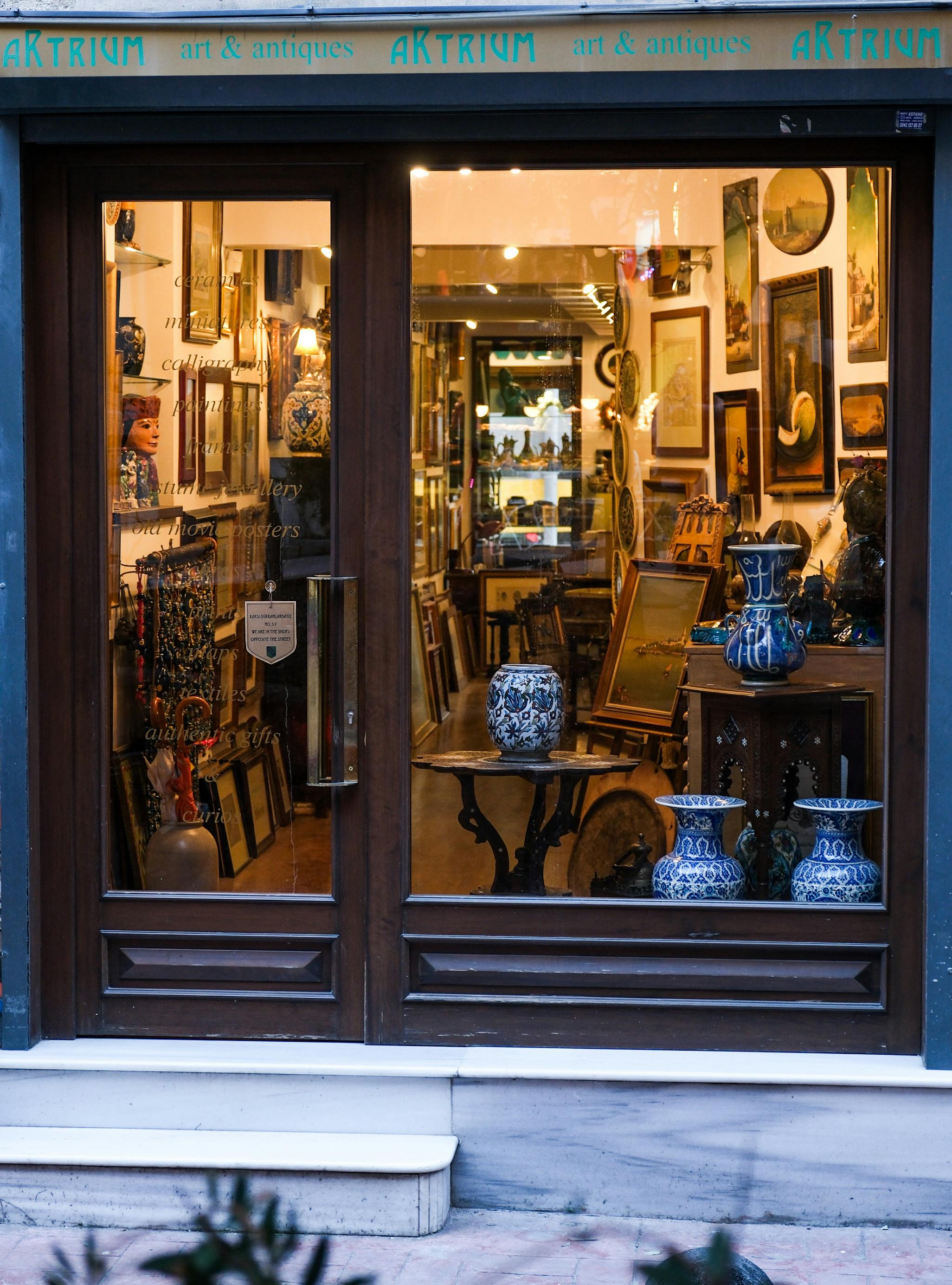 Elegant Antique Shop Front with Curiosities · Free Stock Photo