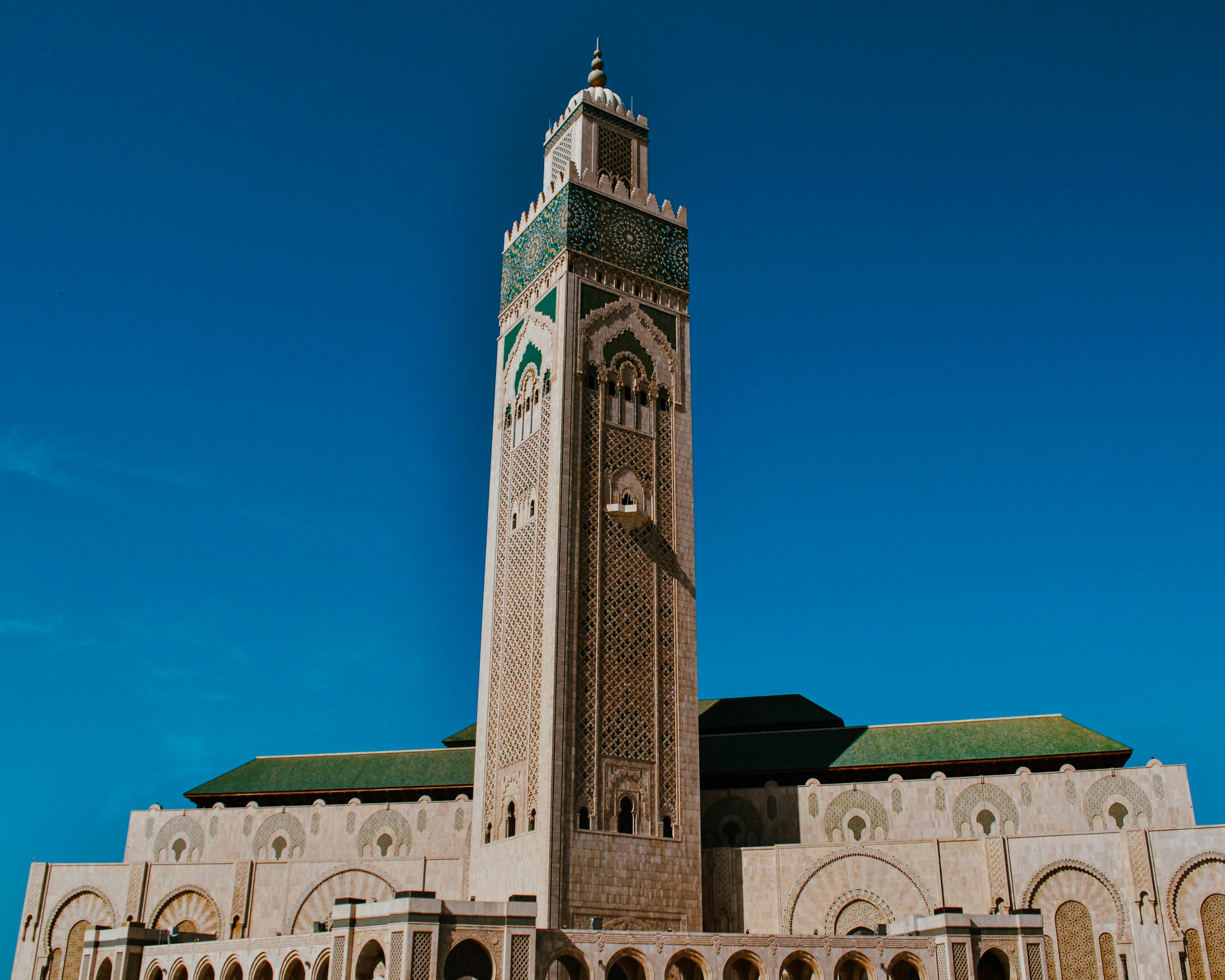 Decorative Mosque Tower against a Blue Sky · Free Stock Photo