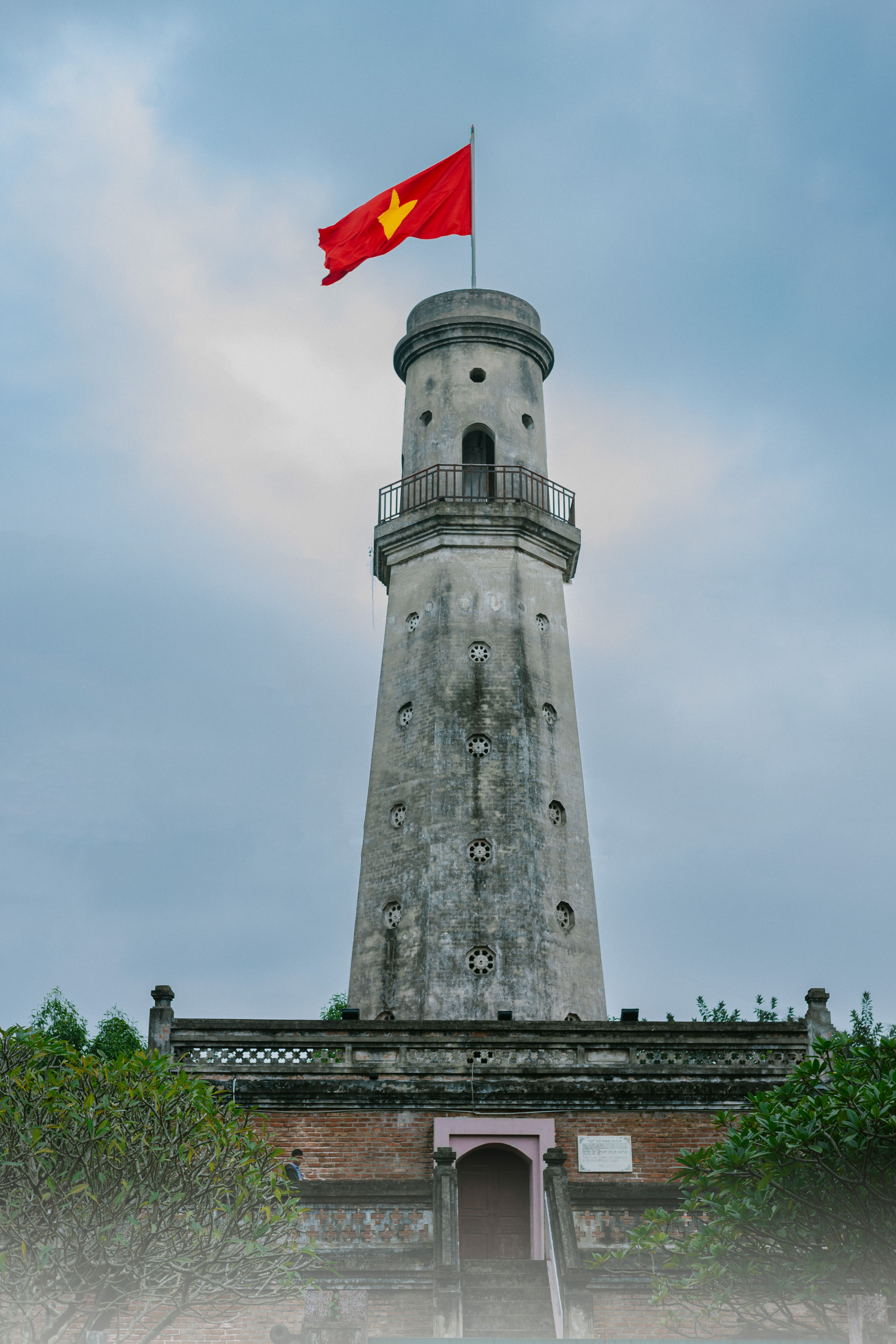 Historic Hanoi Flag Tower with Vietnamese Flag · Free Stock Photo