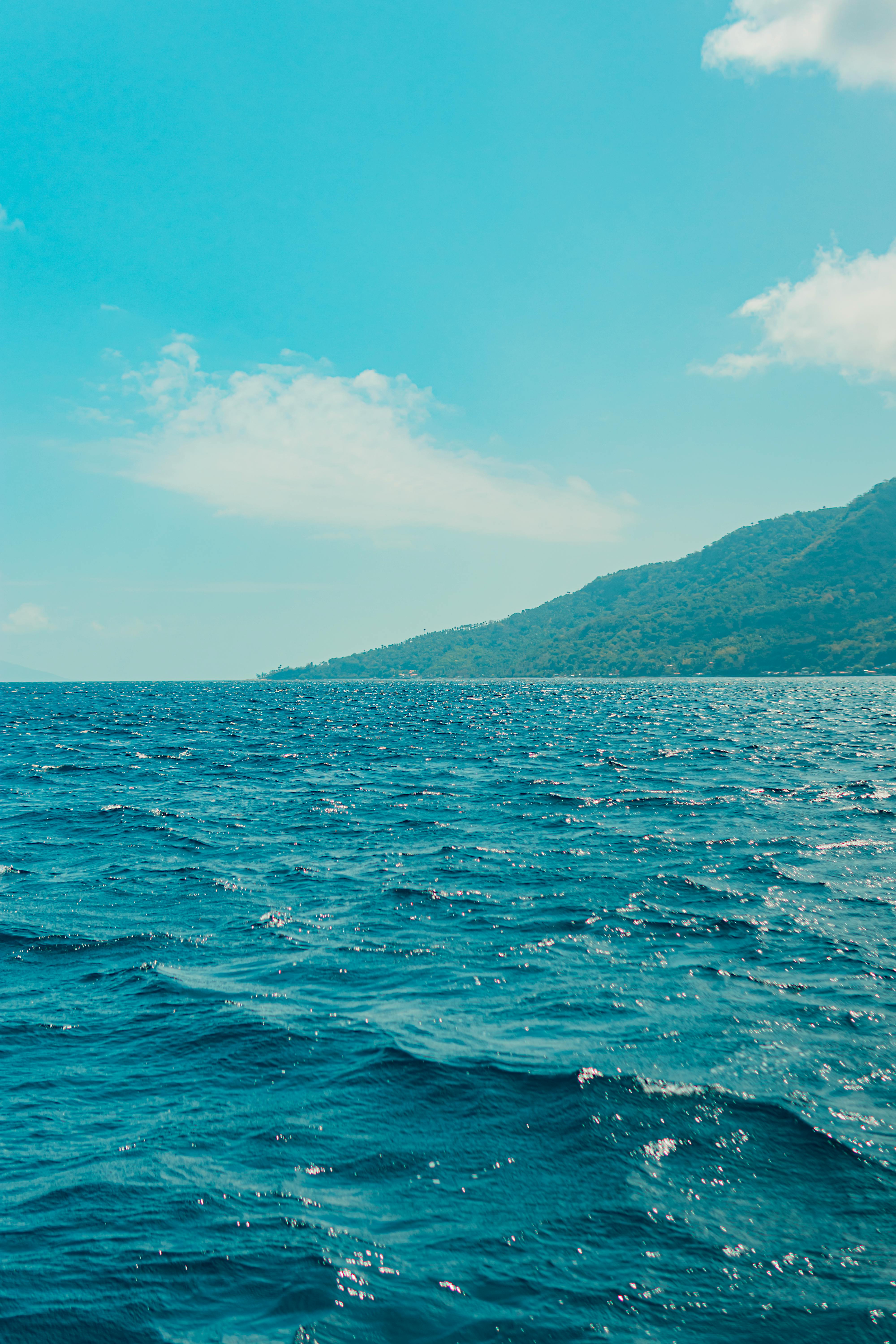 Blue Sea Near Island · Free Stock Photo