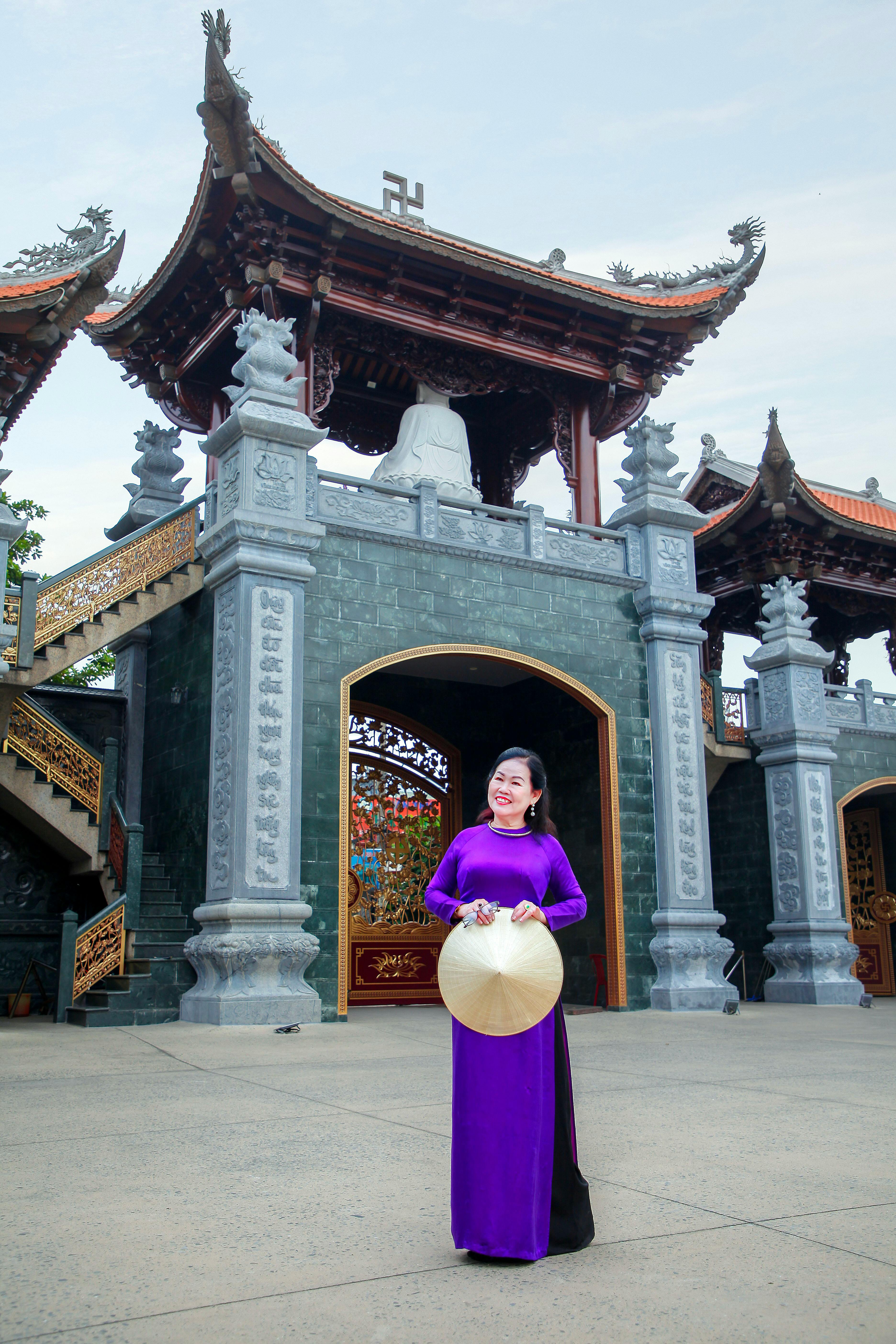 Woman in Purple, Traditional Dress at Vinh Nghiem Buddhist Monastery in ...