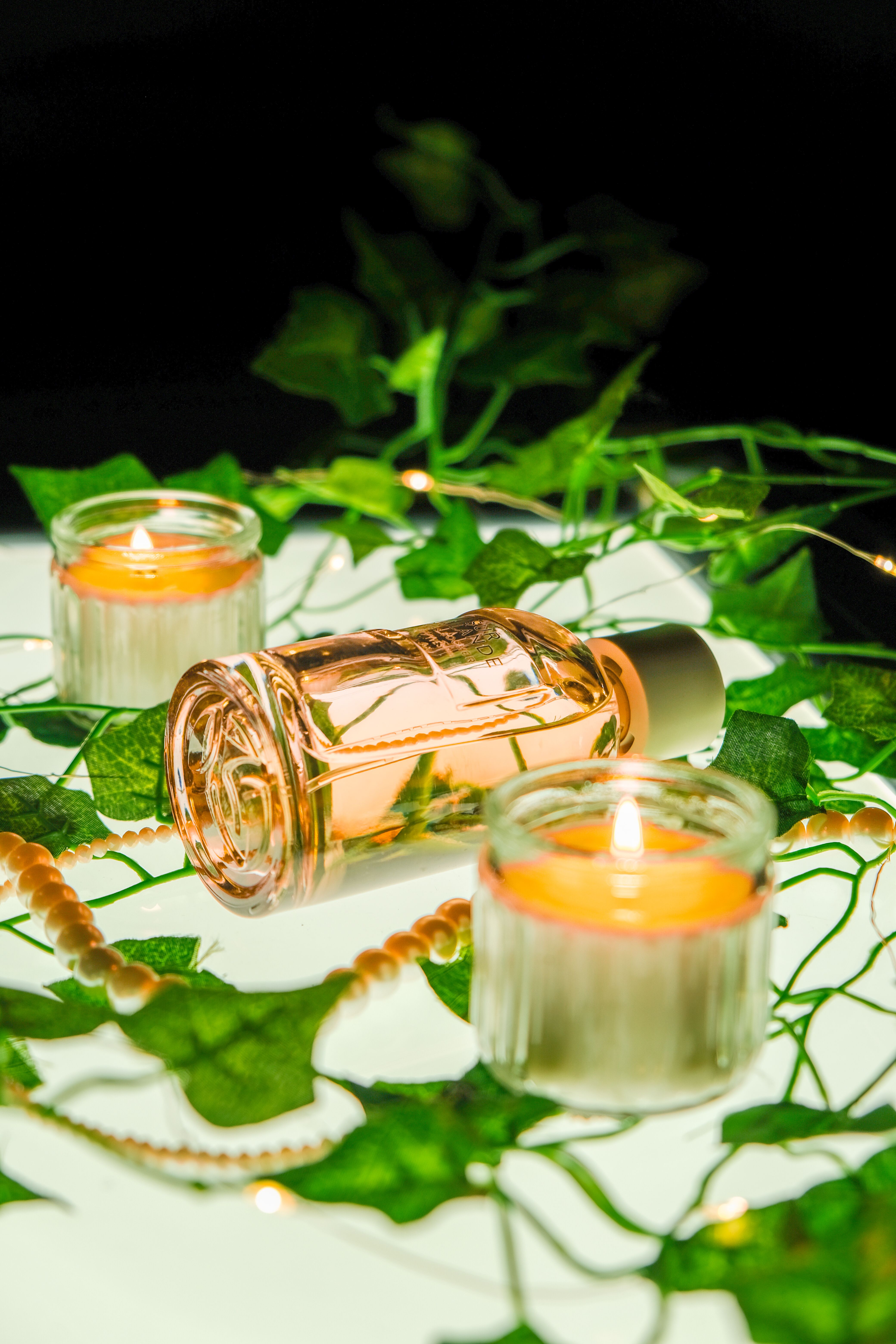 Bottle of Perfumes and Candles · Free Stock Photo