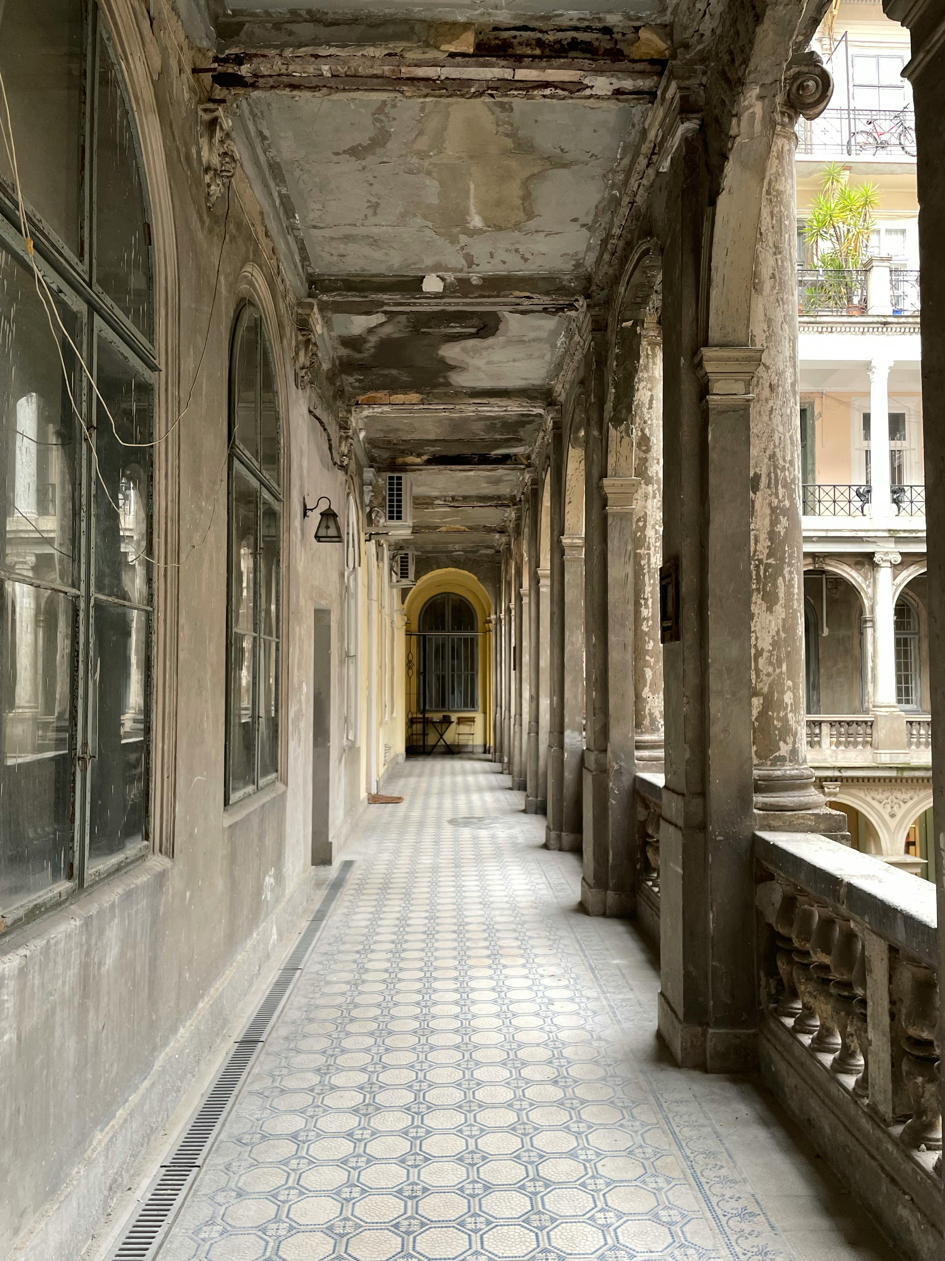 Stone Arcade of an Old Abandoned Building · Free Stock Photo