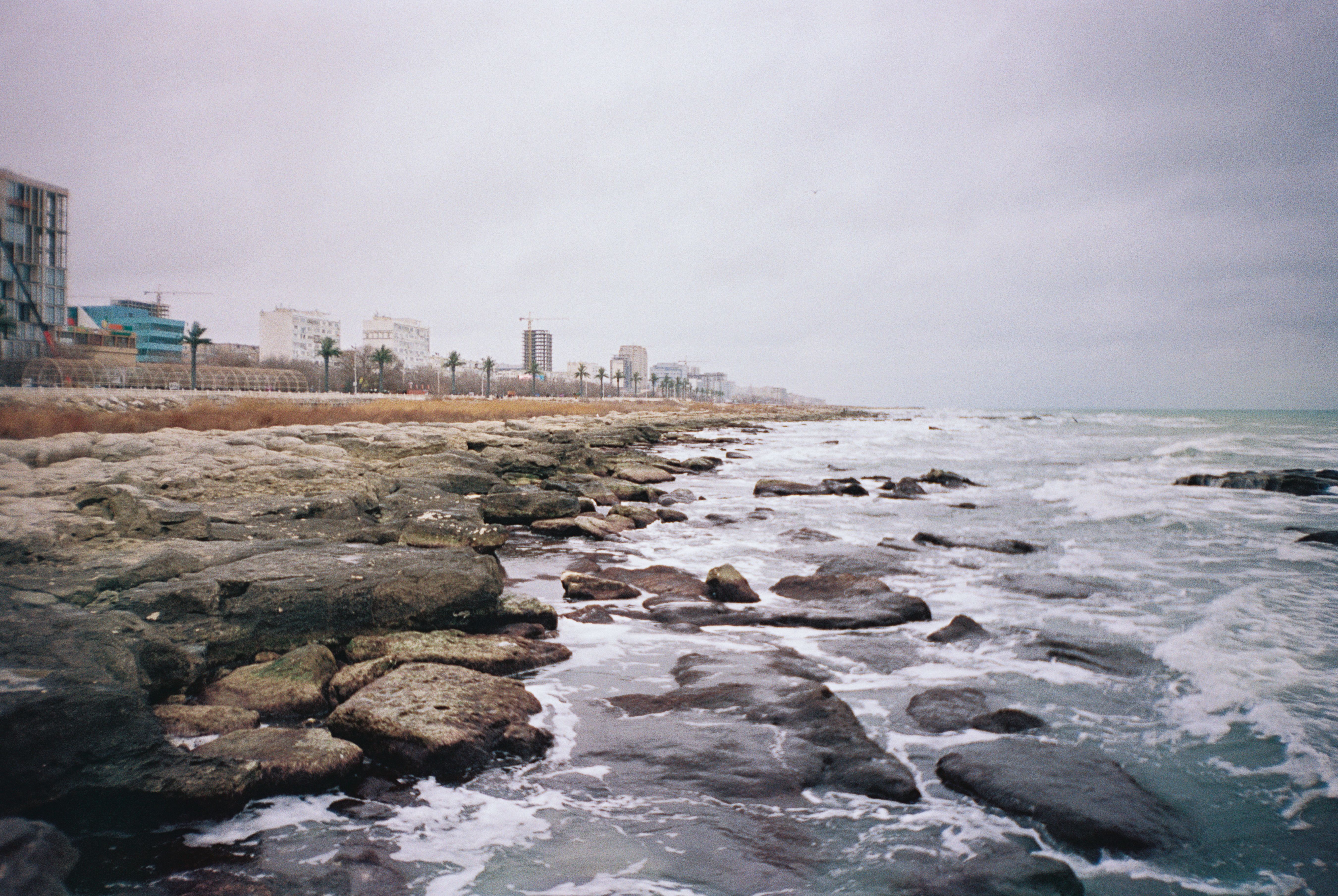 Rocks on Shore of Caspian Sea in Town · Free Stock Photo