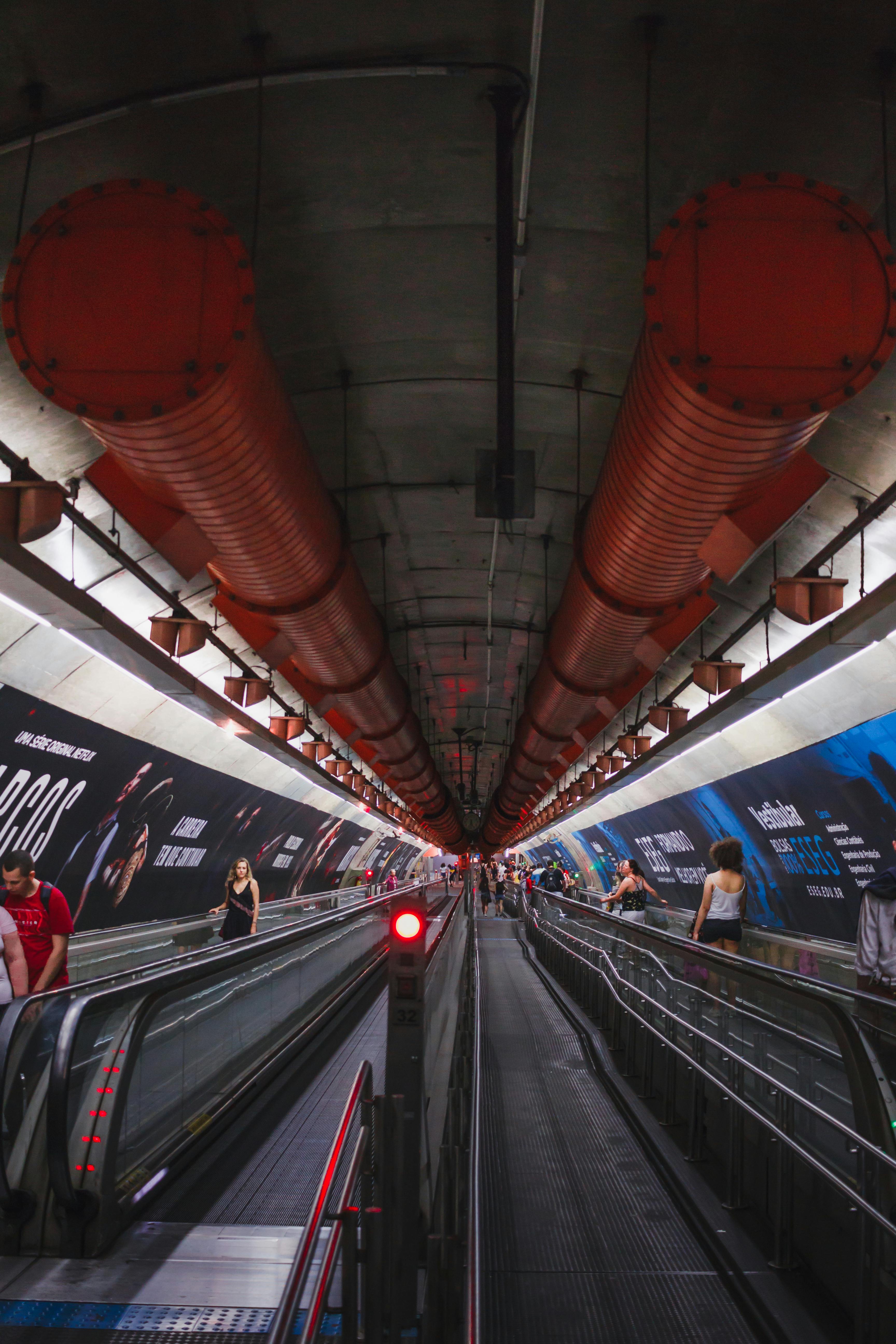 Grayscale Photography of People Walking on Walkalator · Free Stock Photo