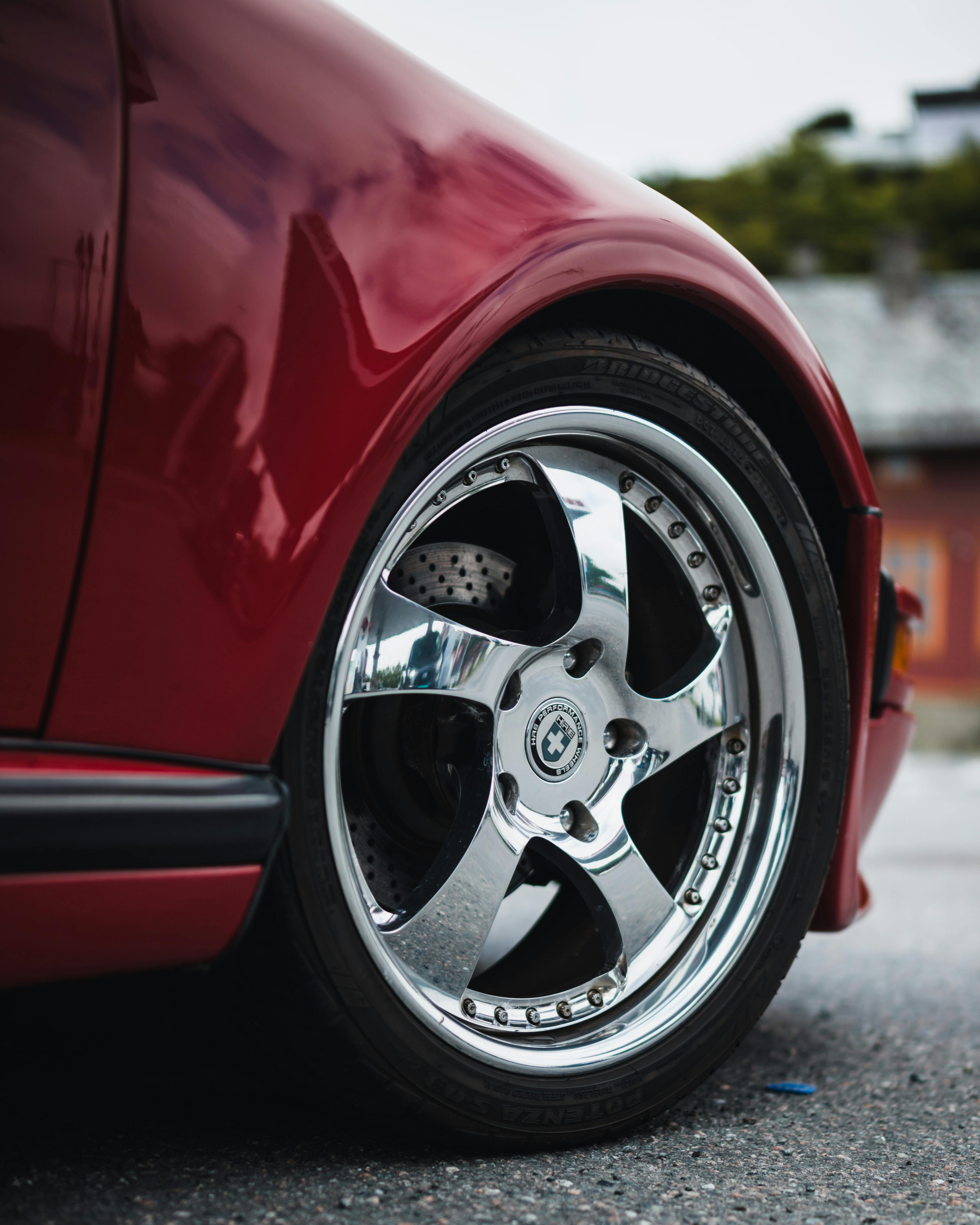 Close-Up of Classic Red Car Wheel and Rim Design · Free Stock Photo