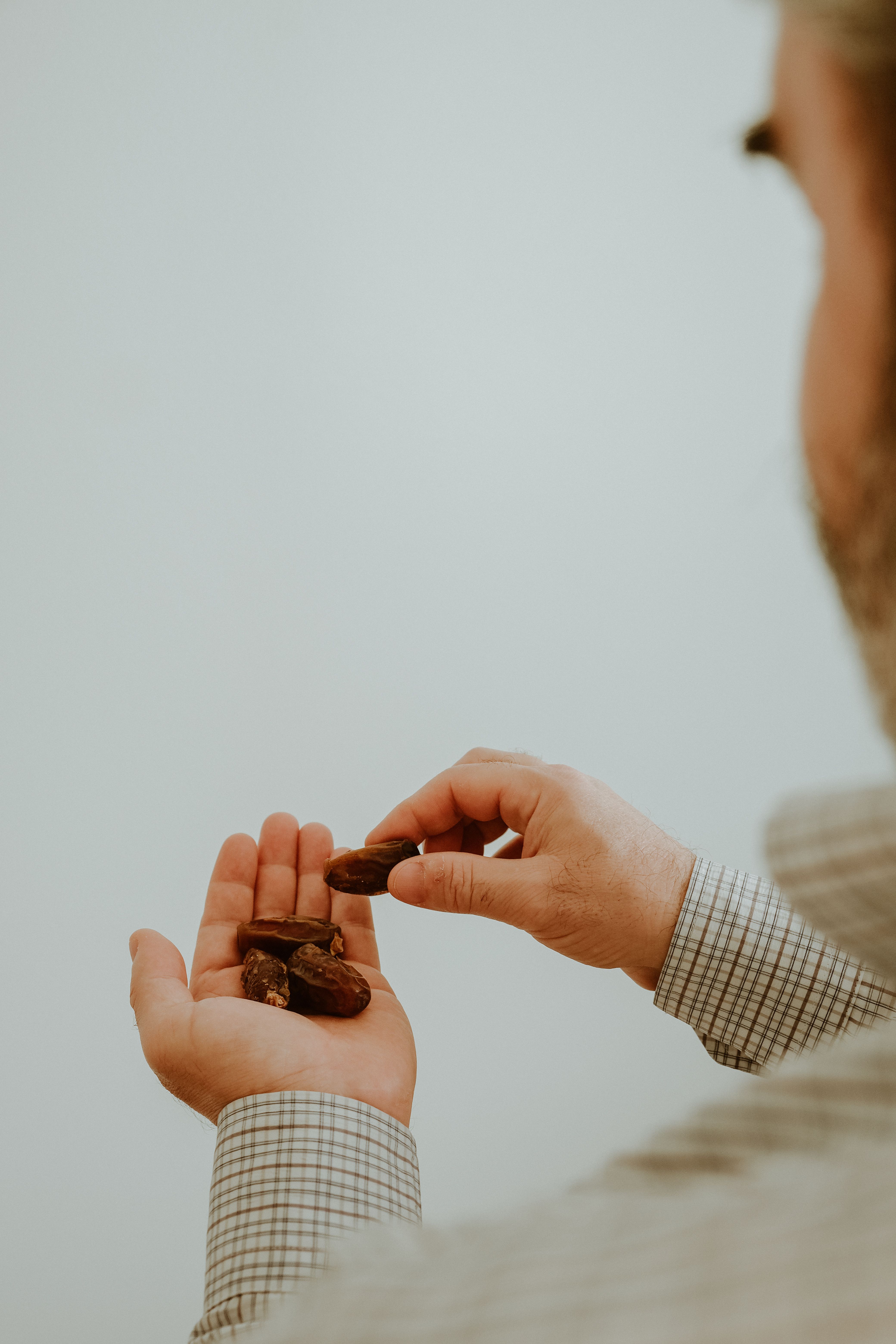Man Hands Holding Snack · Free Stock Photo