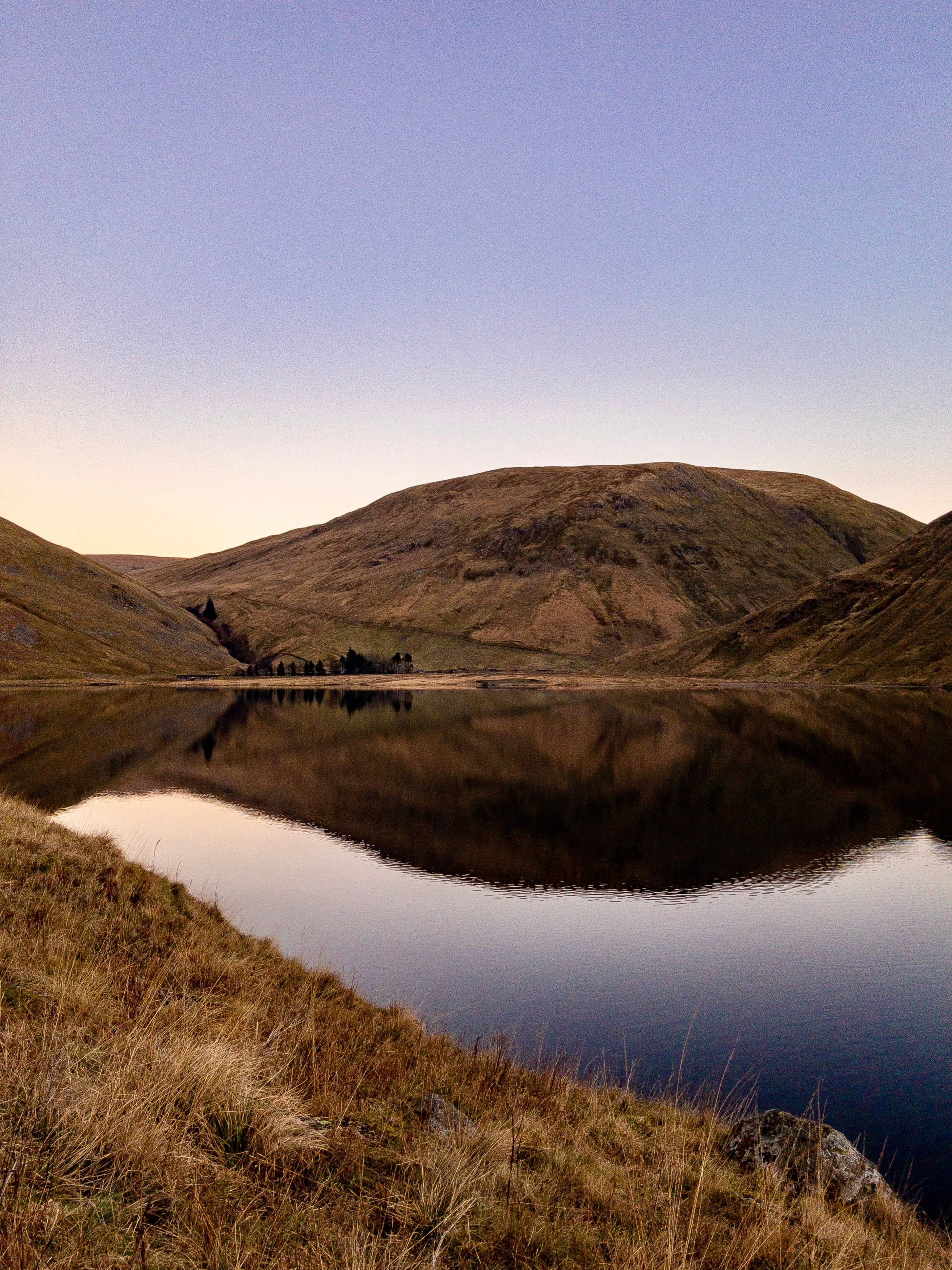 Lake under Clear Sky in Countryside · Free Stock Photo