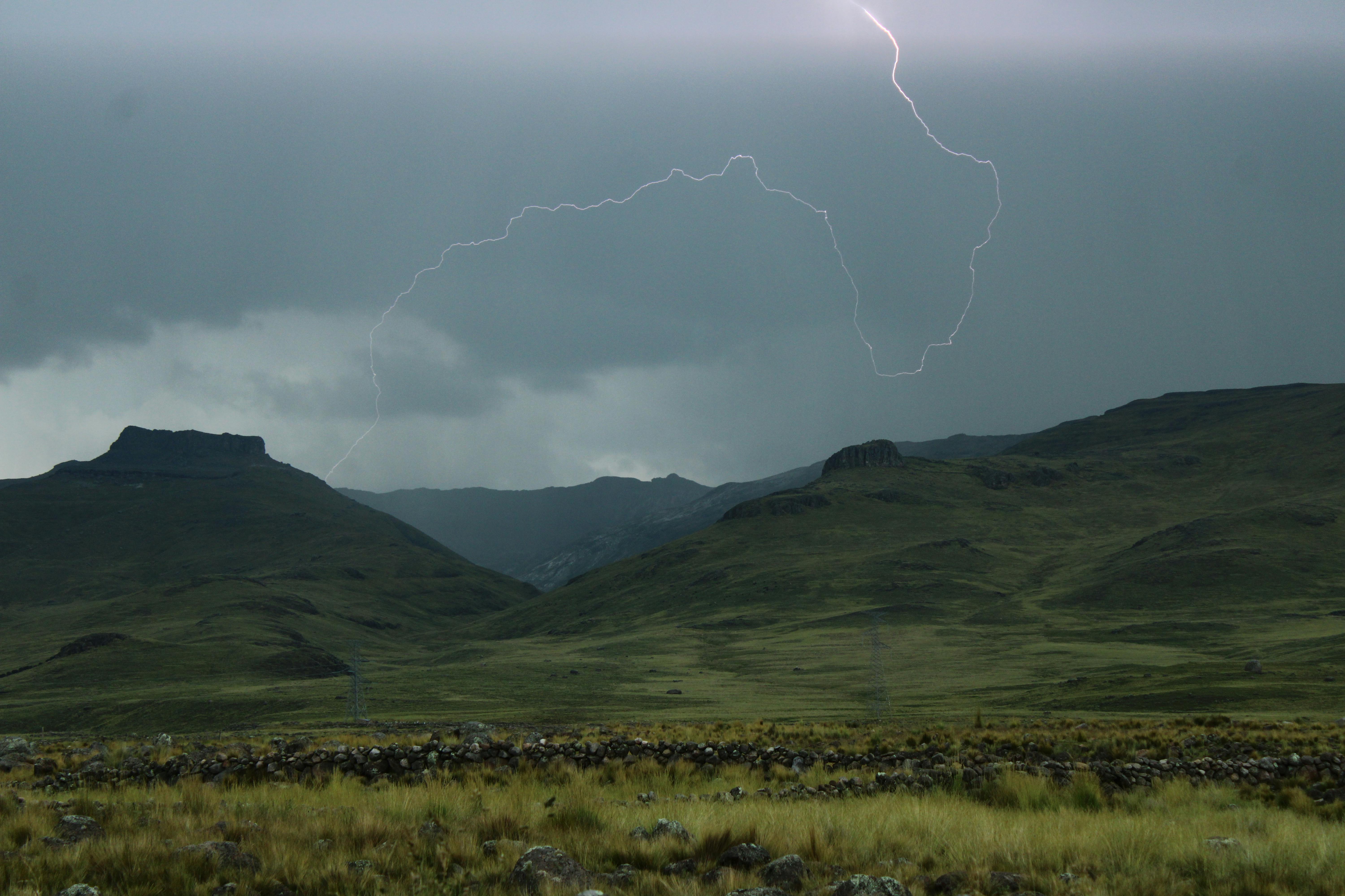 Thunderstorm over Grassland on Hills · Free Stock Photo