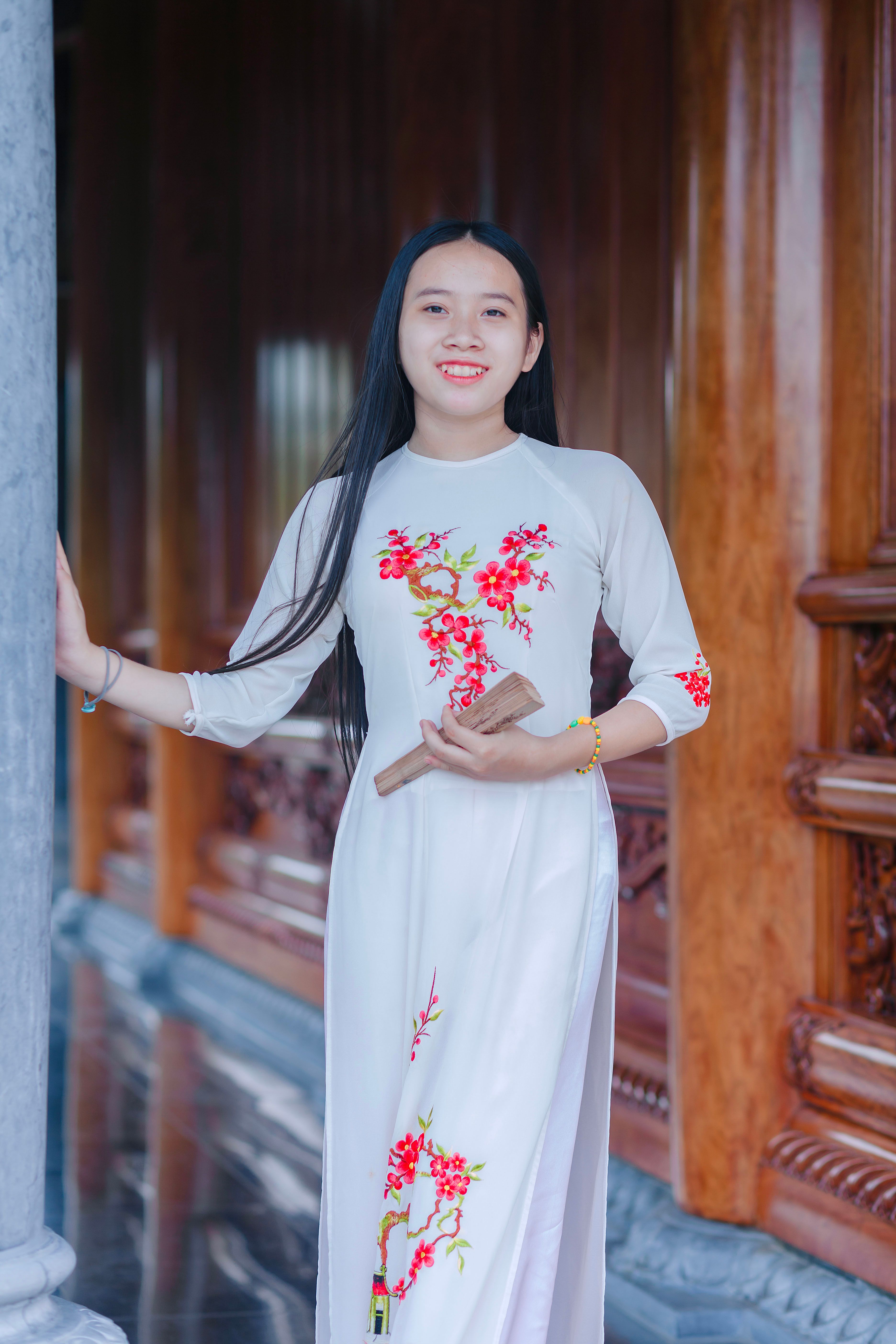Smiling Woman in White, Traditional Dress · Free Stock Photo