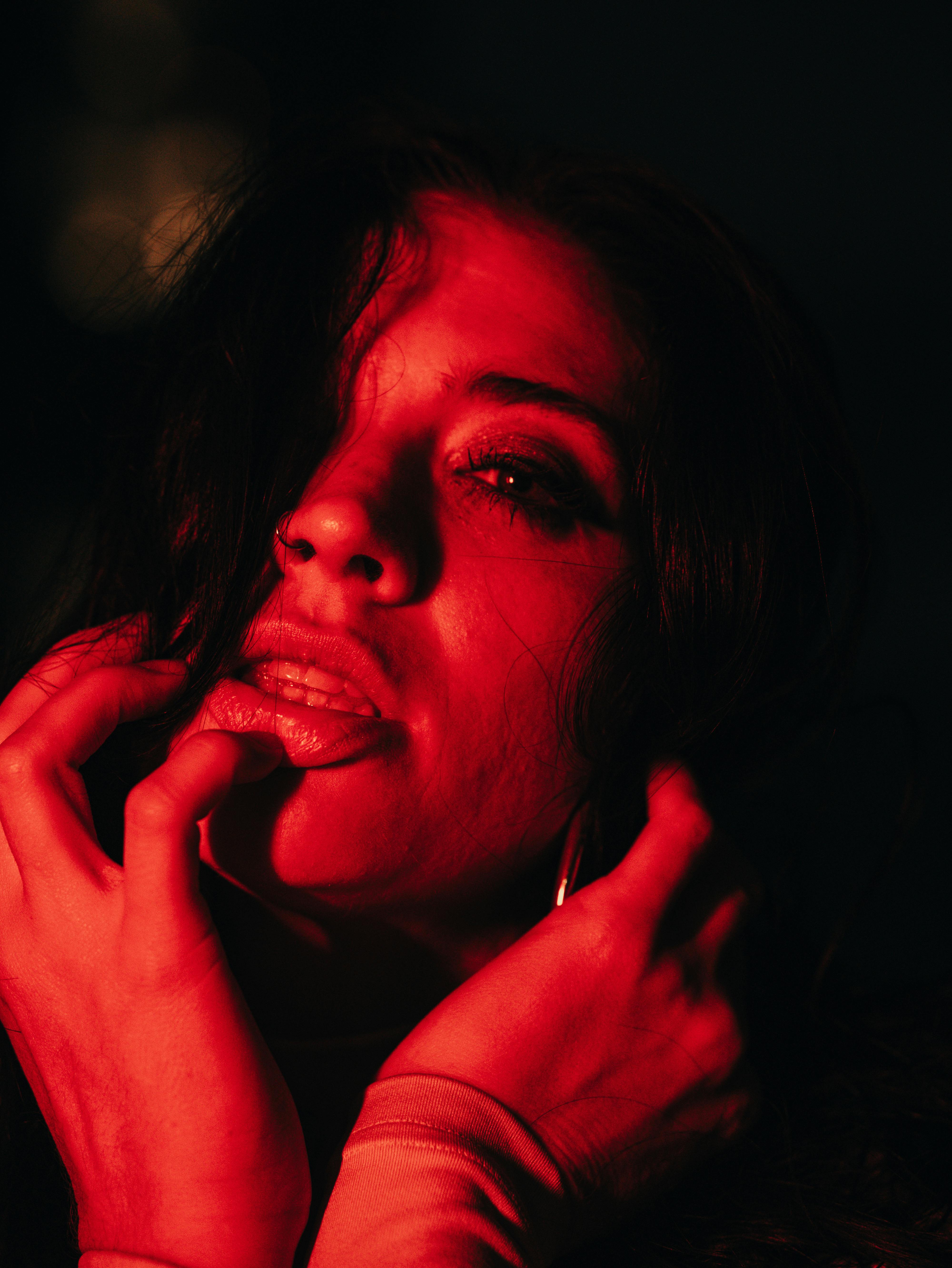 Portrait of a Woman in Red Lighting · Free Stock Photo