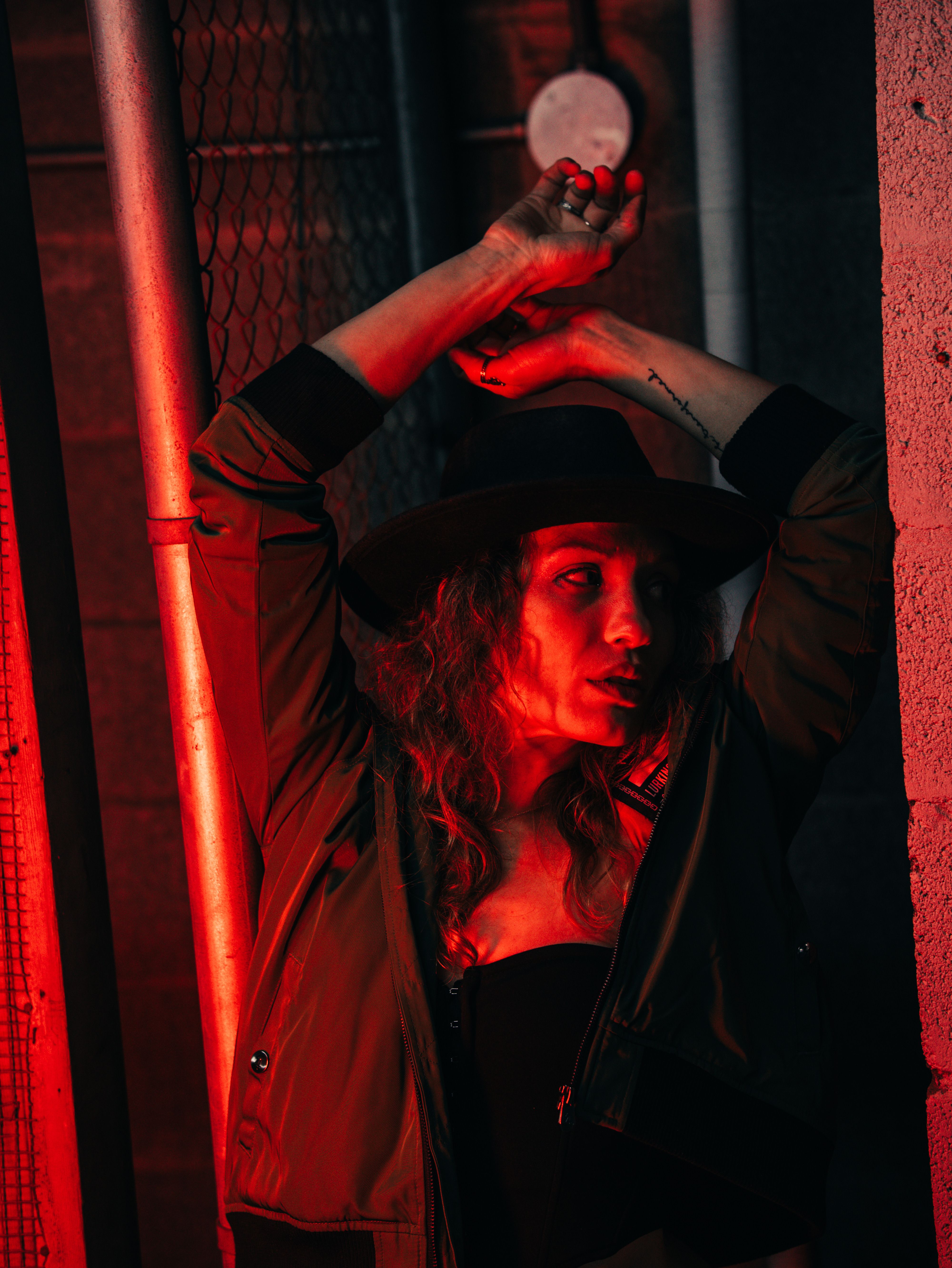A Woman Posing in Red Lighting · Free Stock Photo