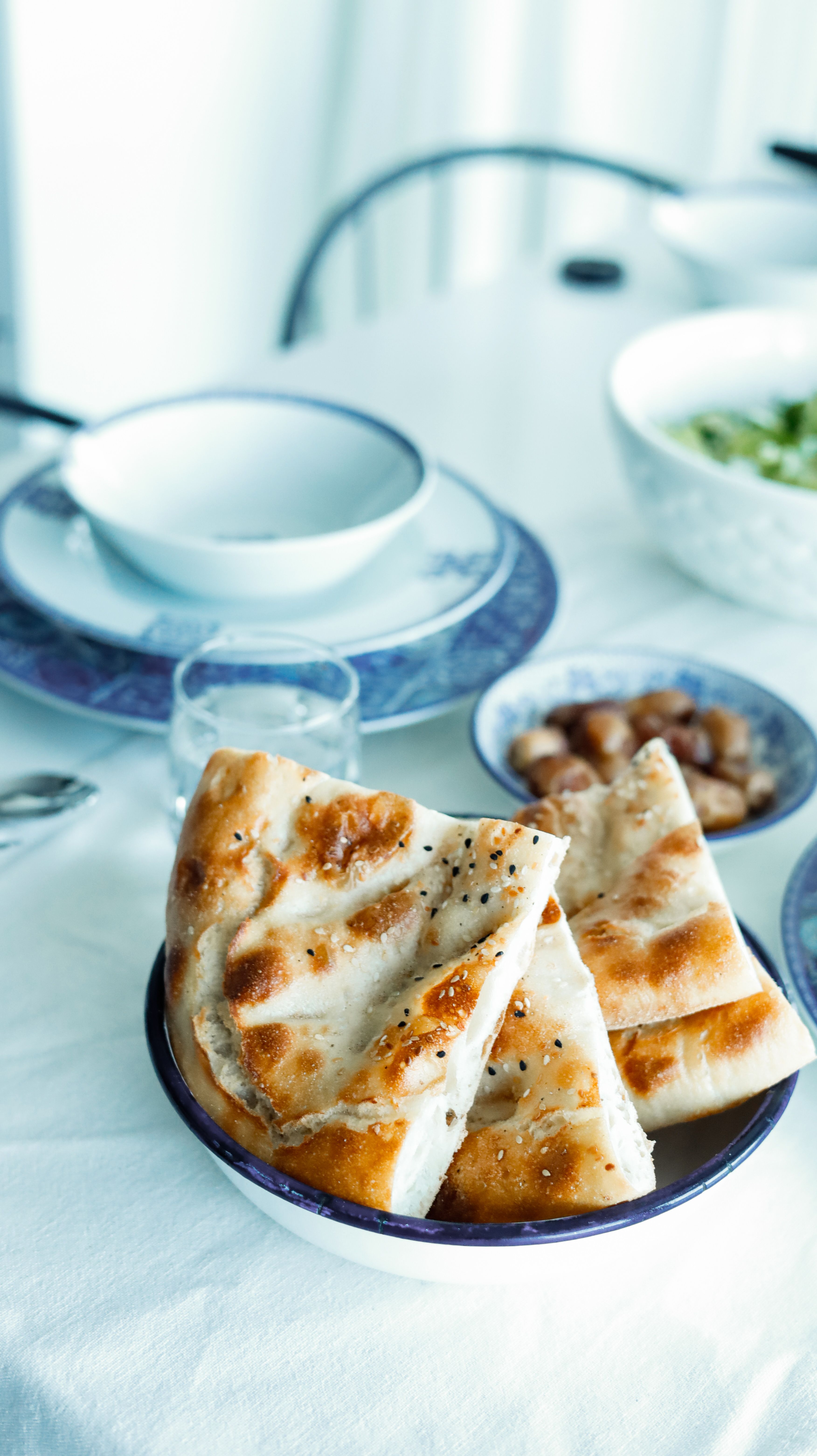 Close-up of Flatbread Slices on a Table · Free Stock Photo