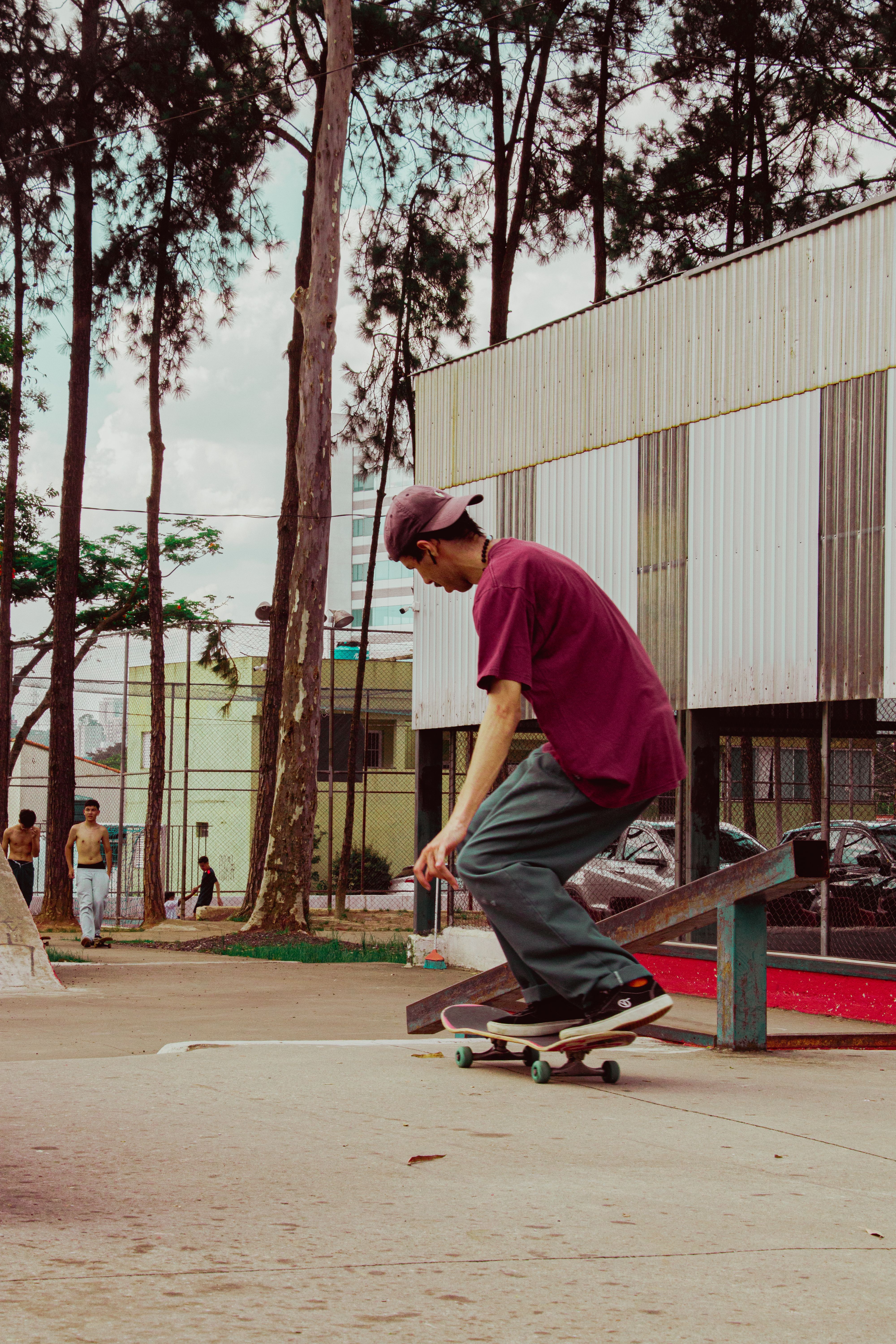 Back View of Man Skateboarding · Free Stock Photo