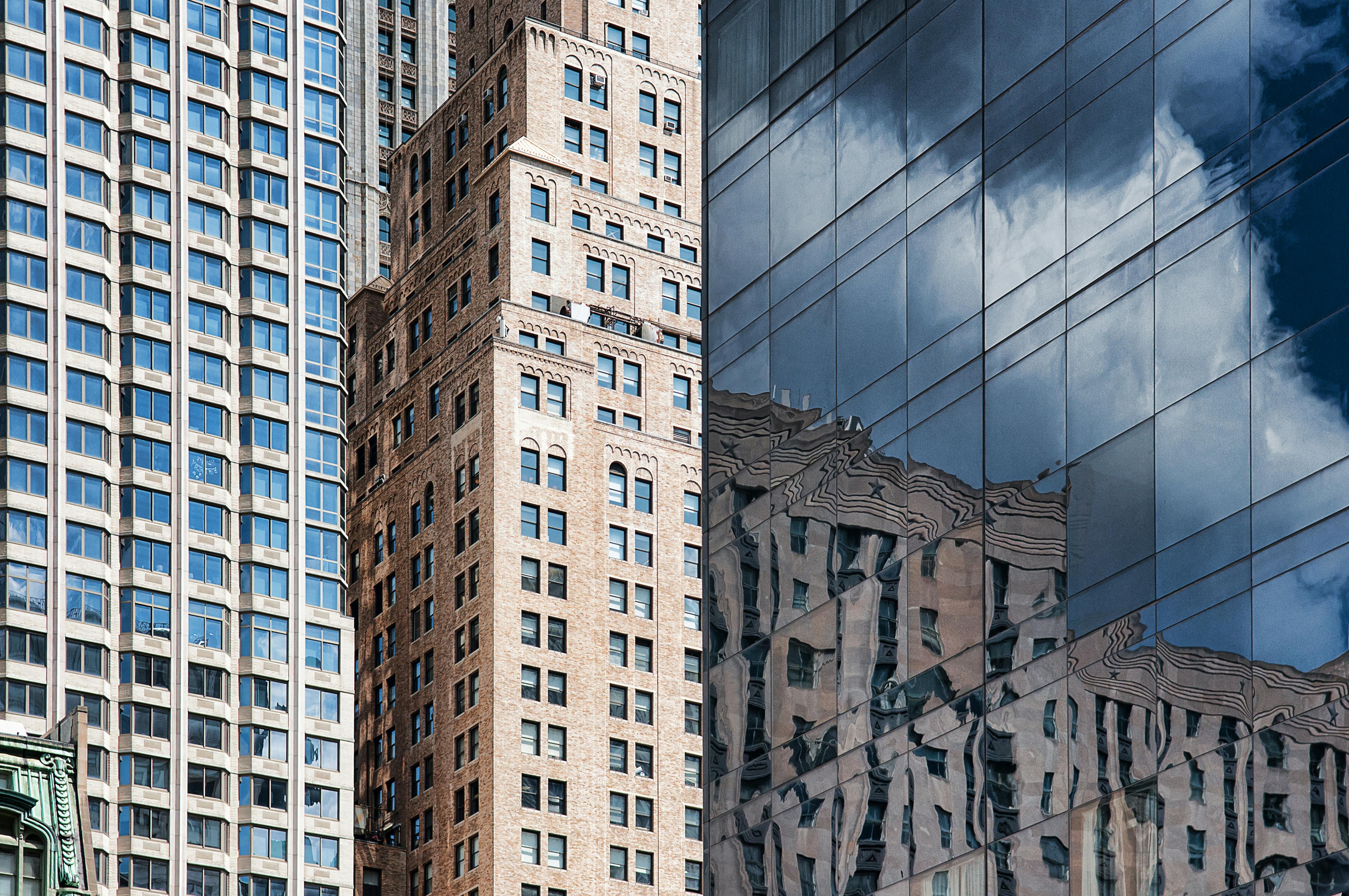 Majestic stone building near glass skyscraper in downtown · Free Stock ...