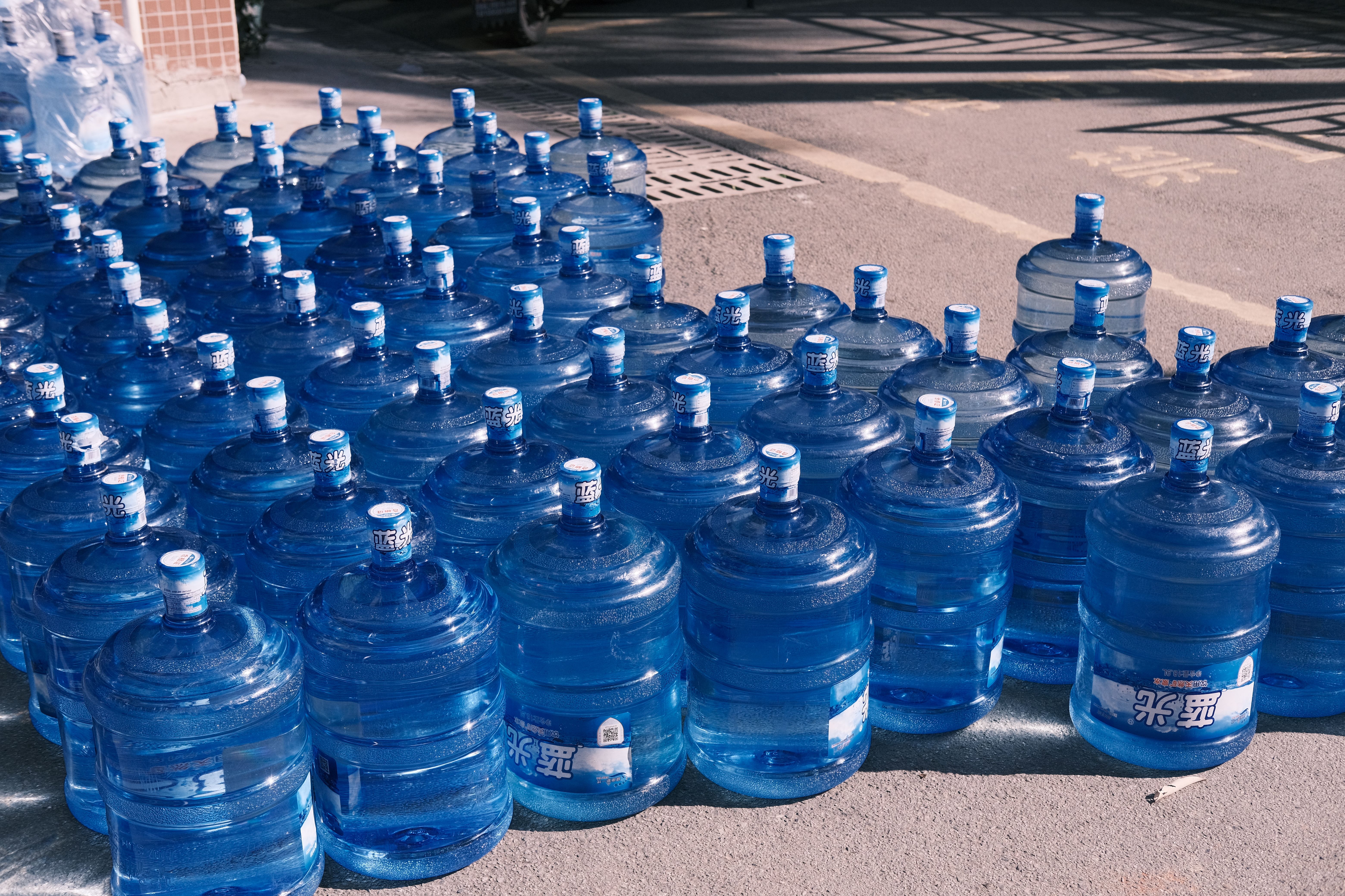 Jugs with Water on a Street · Free Stock Photo