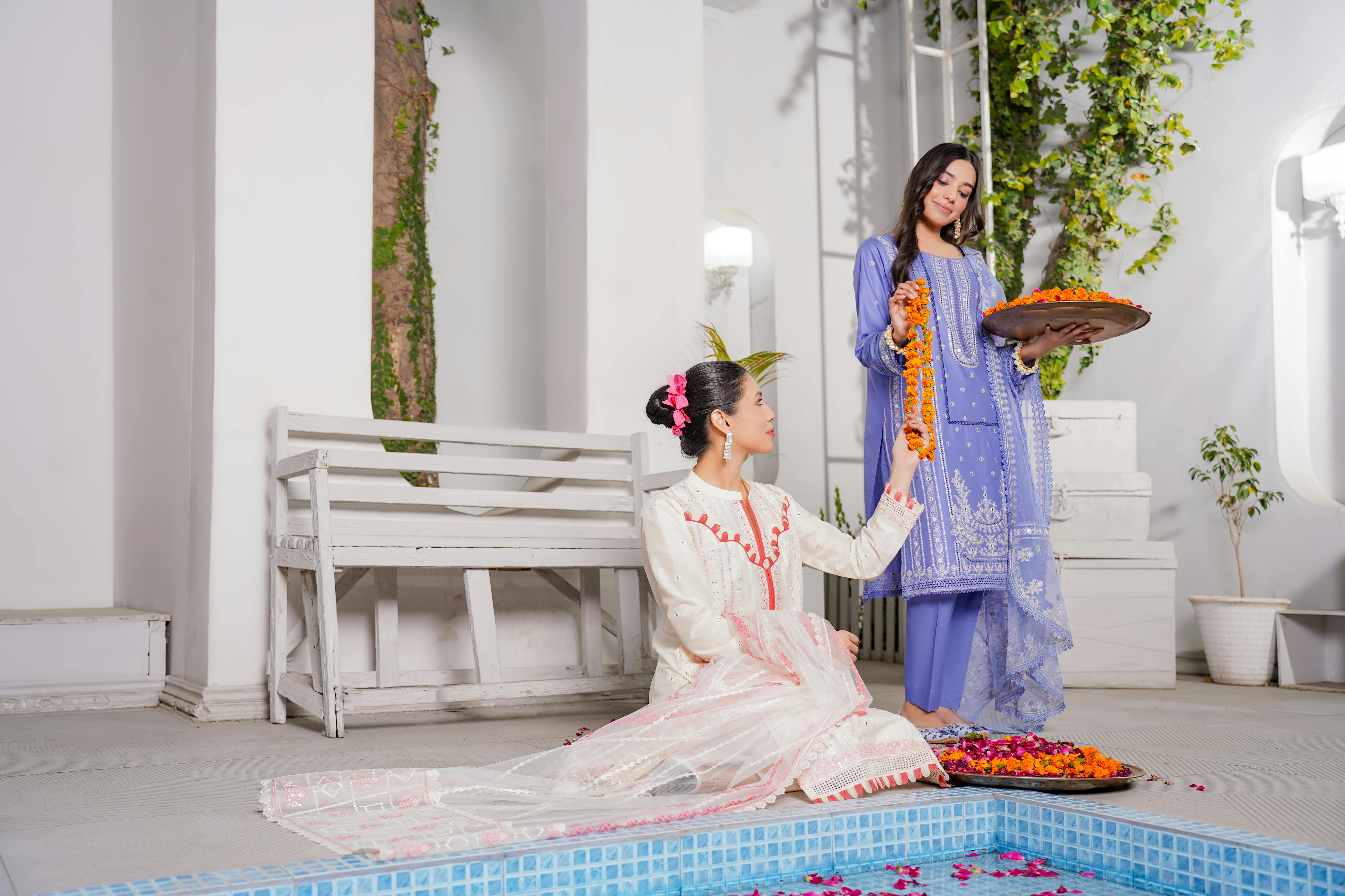 Women in Traditional Clothing and with Flowers Petals on Trays · Free ...
