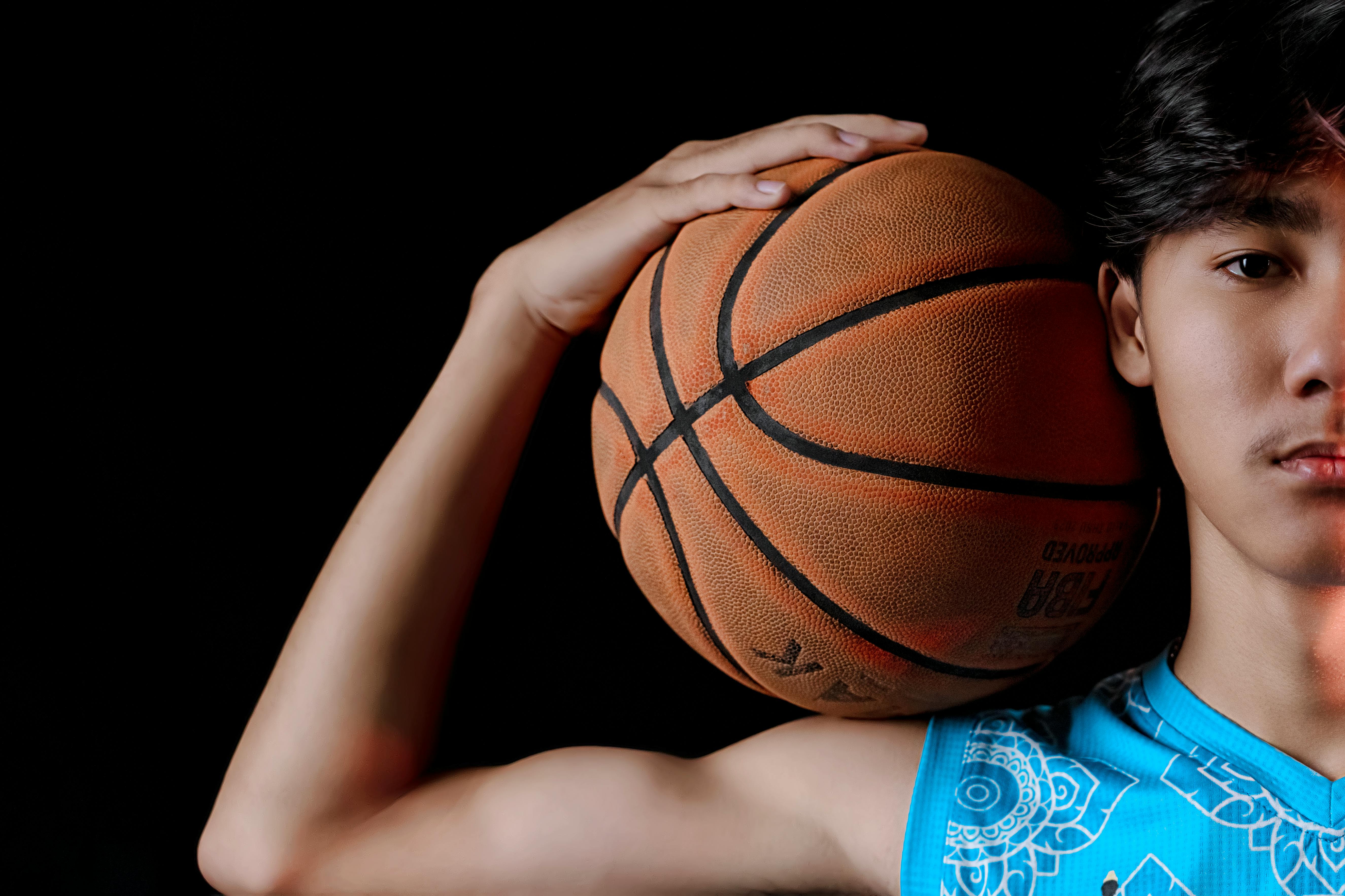 Basketballer with Ball on Shoulder · Free Stock Photo