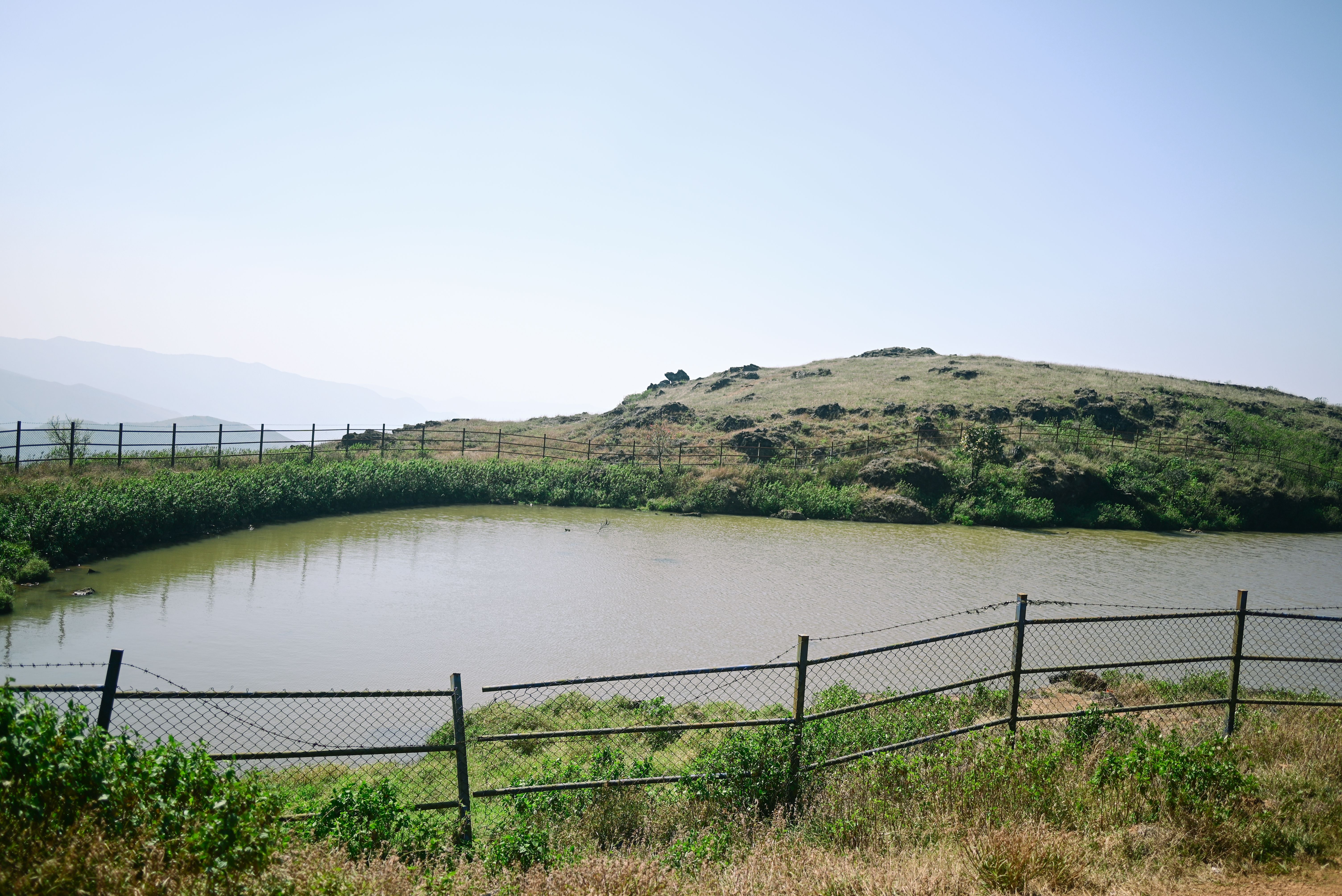 Fenced Pond in the Mountains · Free Stock Photo